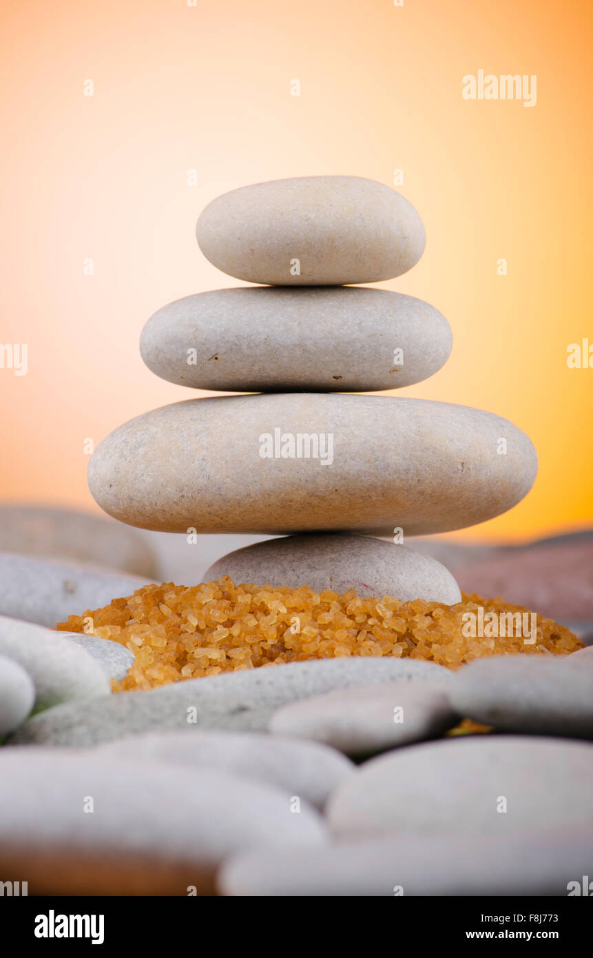 Balanced pebbles with colour background Stock Photo - Alamy