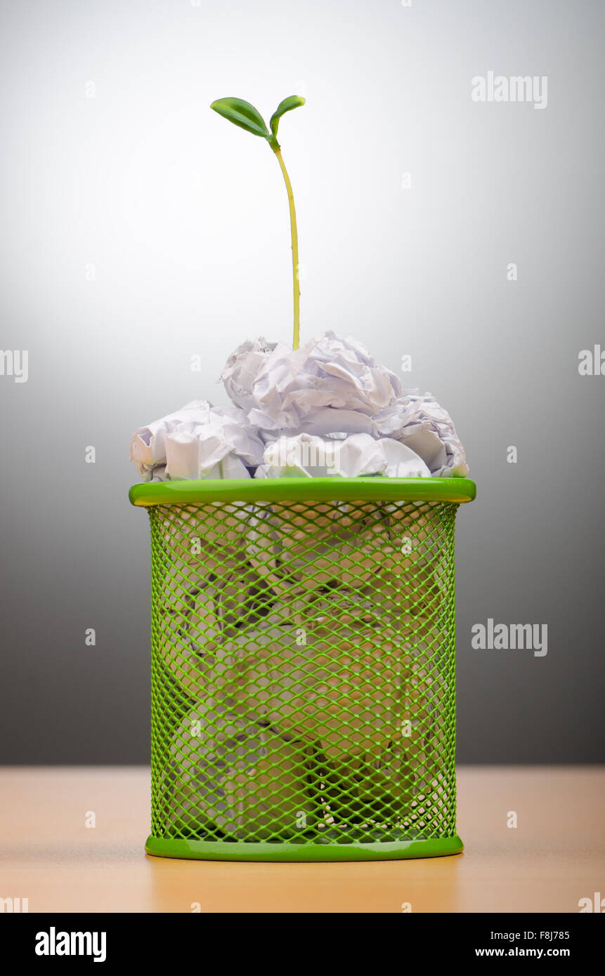 Green seedlings growing out of paper Stock Photo - Alamy