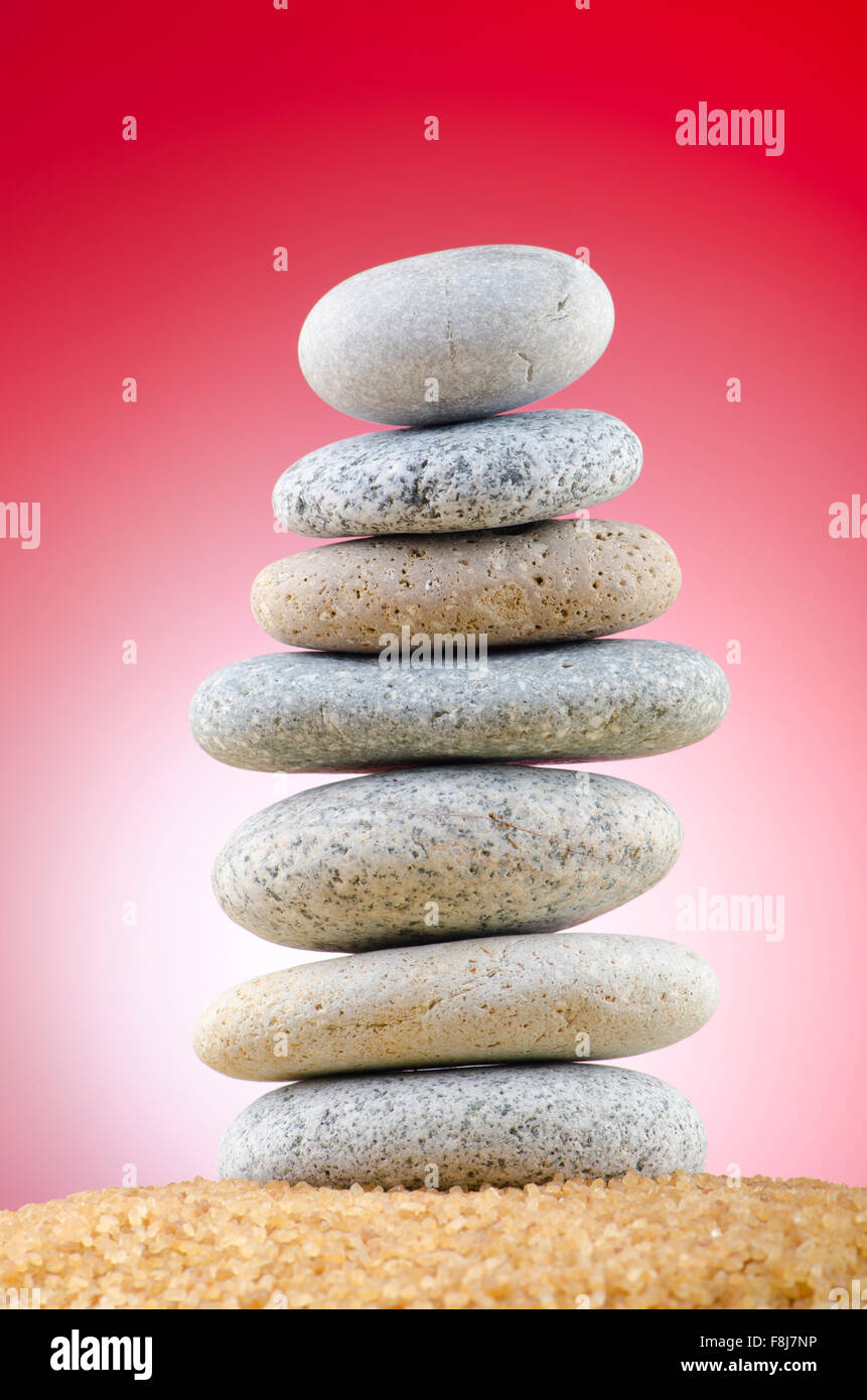 Balanced pebbles with colour background Stock Photo - Alamy