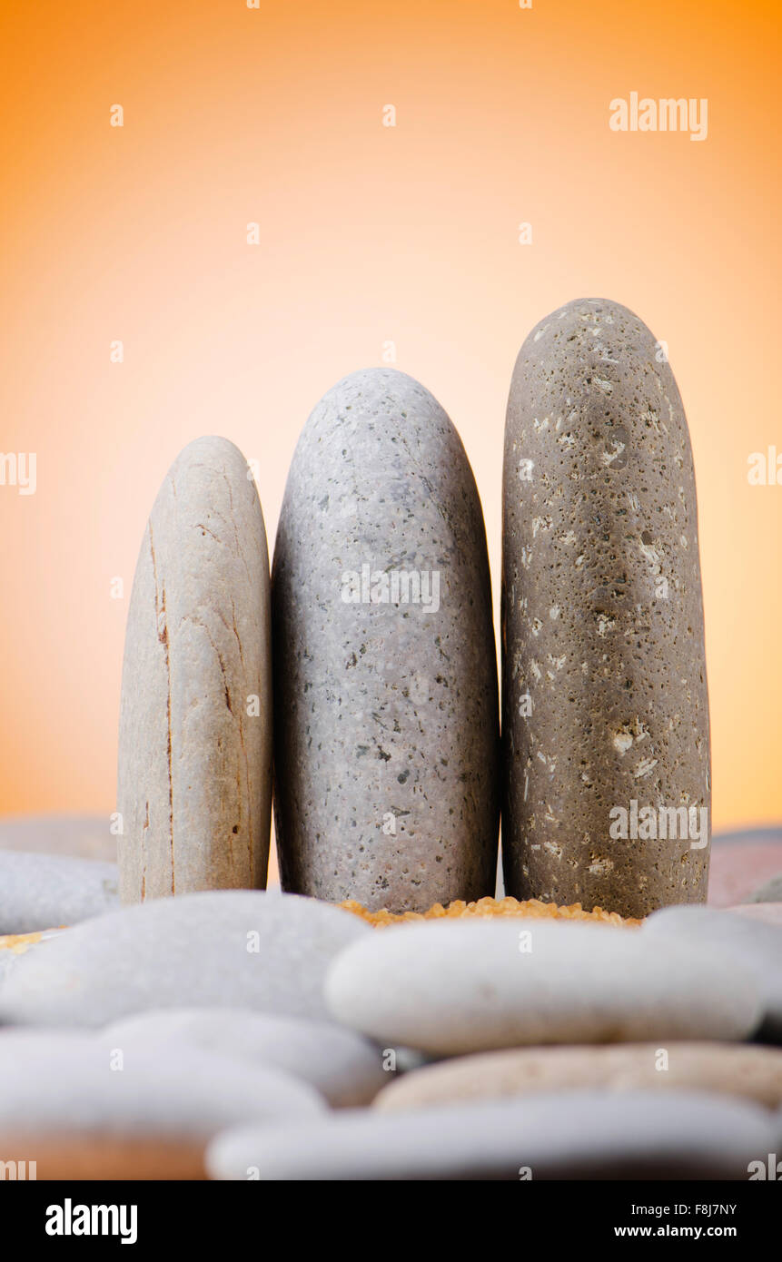 Balanced pebbles with colour background Stock Photo - Alamy