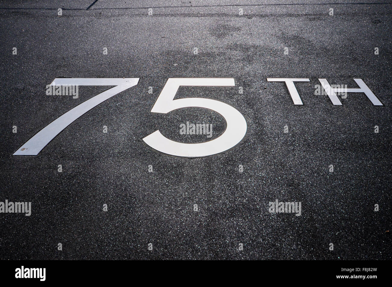 metal lettering 75th on the pavement on the promenade in front of hotel ...
