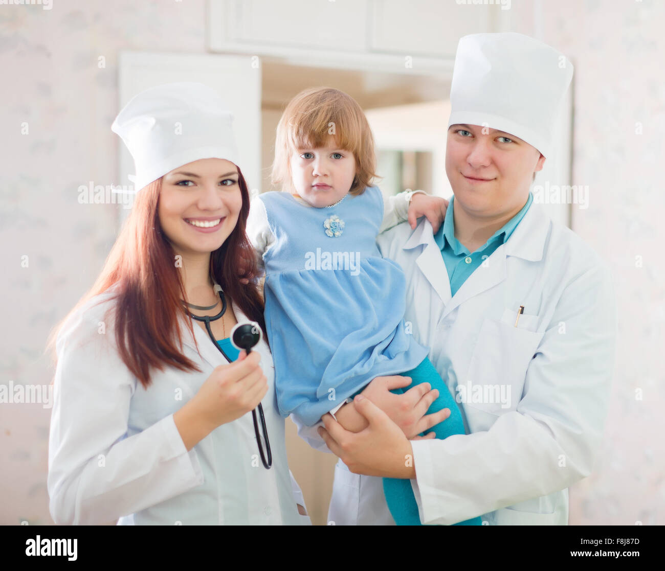 friendly doctors with child in medical clinic Stock Photo - Alamy