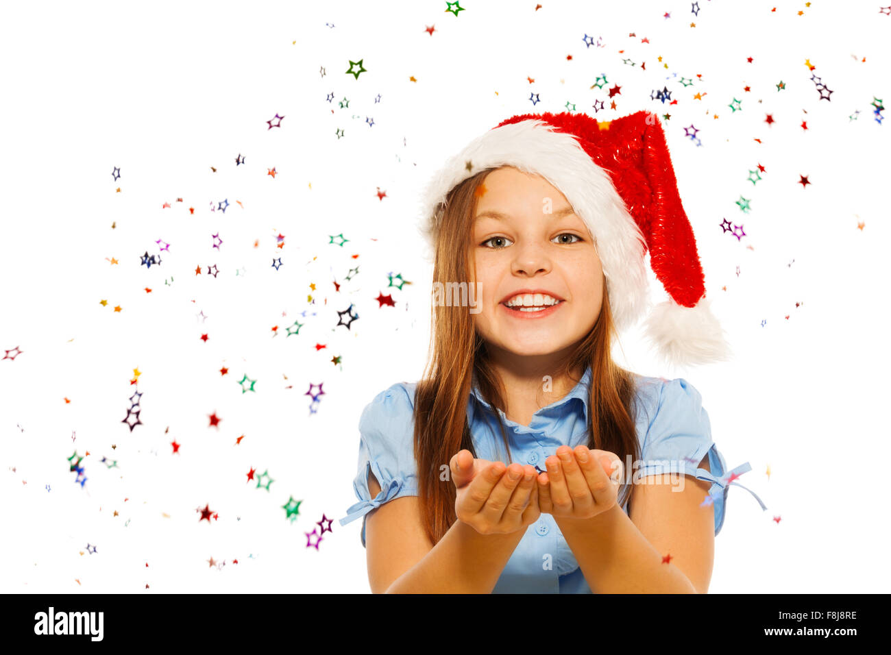 Happy beautiful girl blow confetti and smile Stock Photo - Alamy