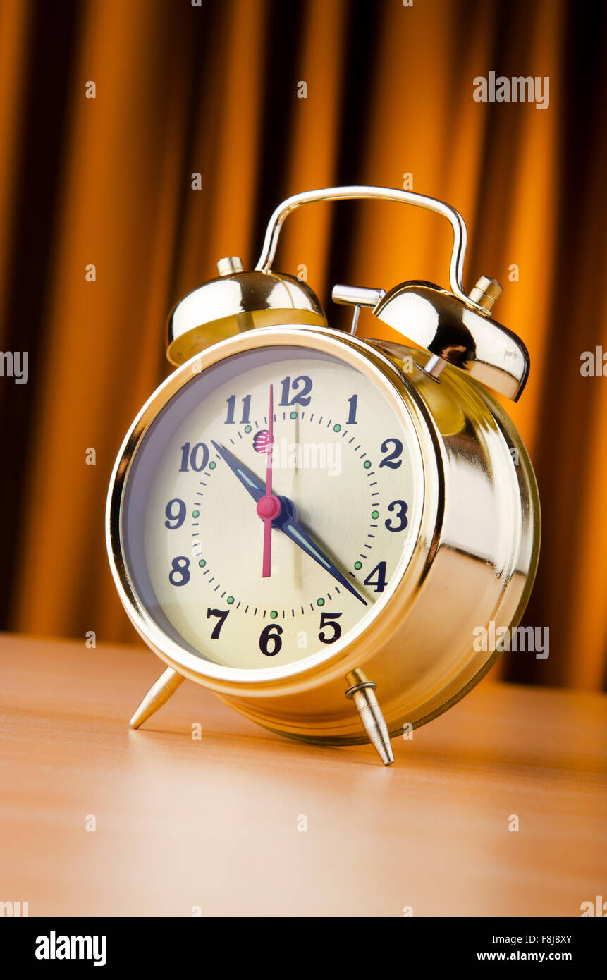 Time concept with alarm clock Stock Photo - Alamy