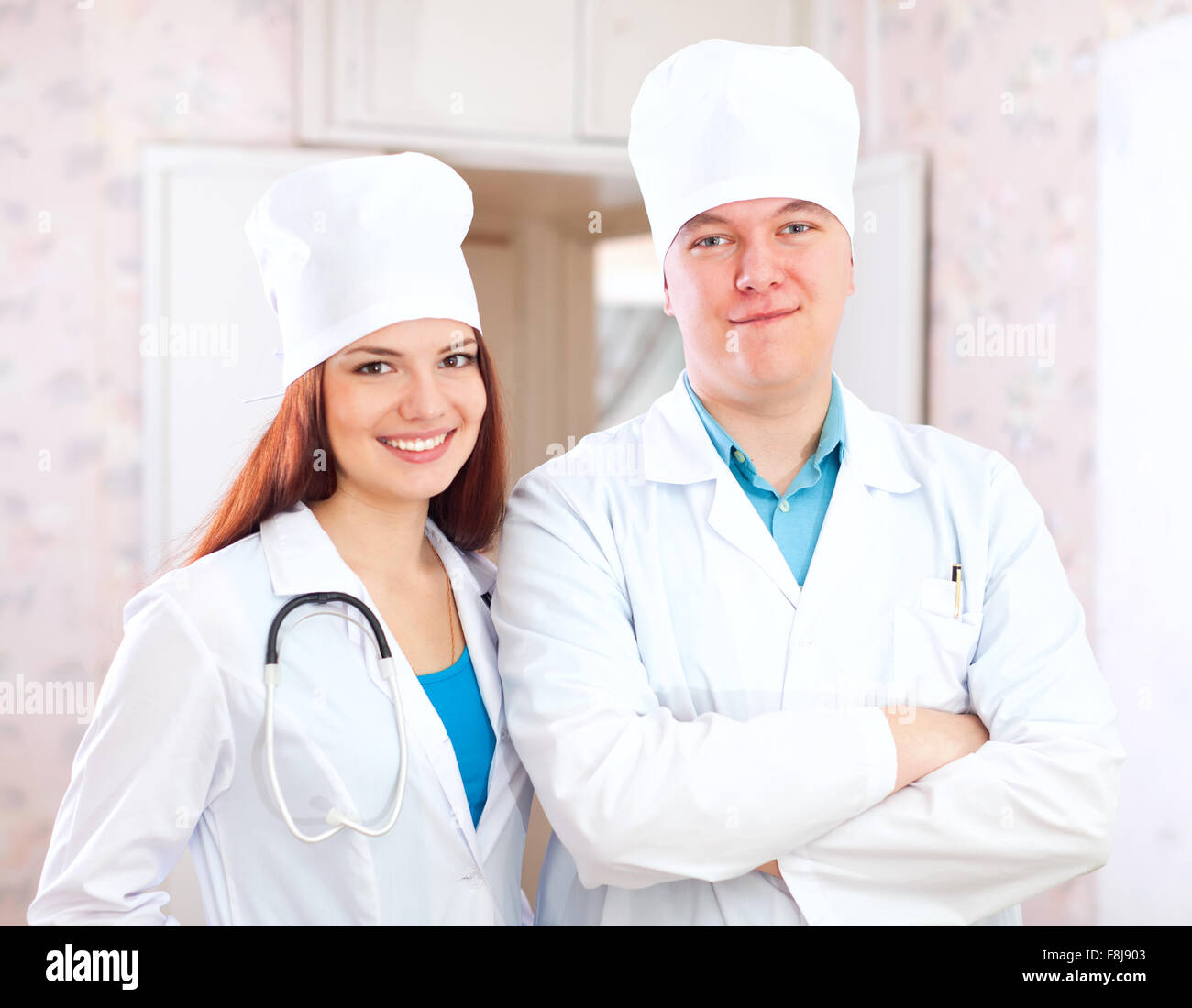 Portrait of friendly doctors in clinic interior Stock Photo - Alamy