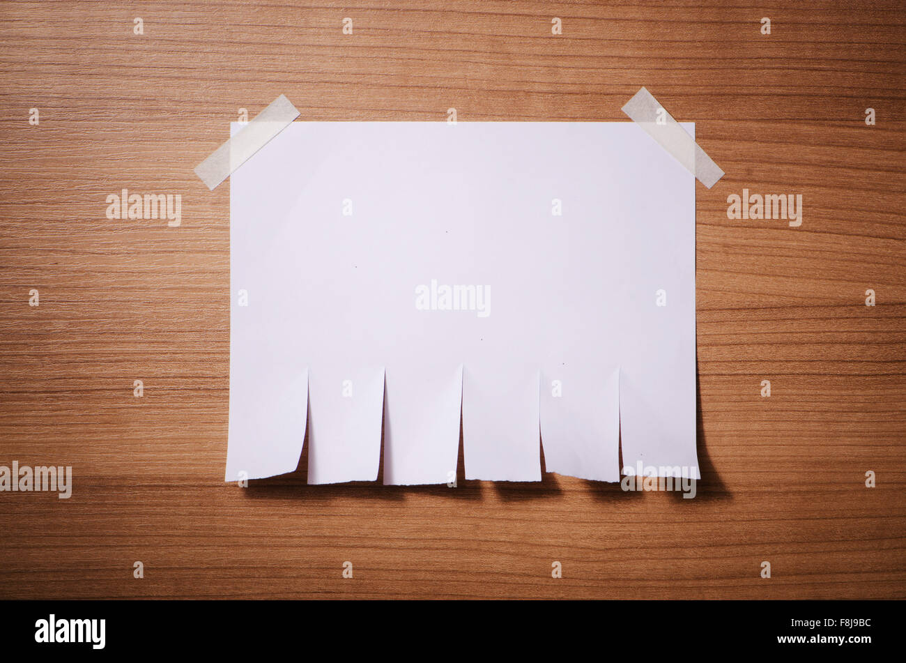 Tear off paper notice on the wall Stock Photo - Alamy