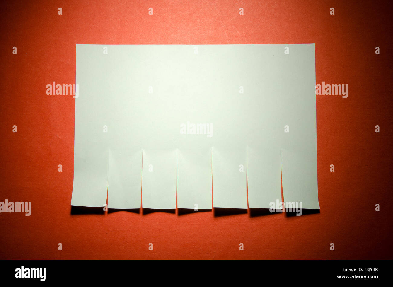 Tear off paper notice on the wall Stock Photo - Alamy