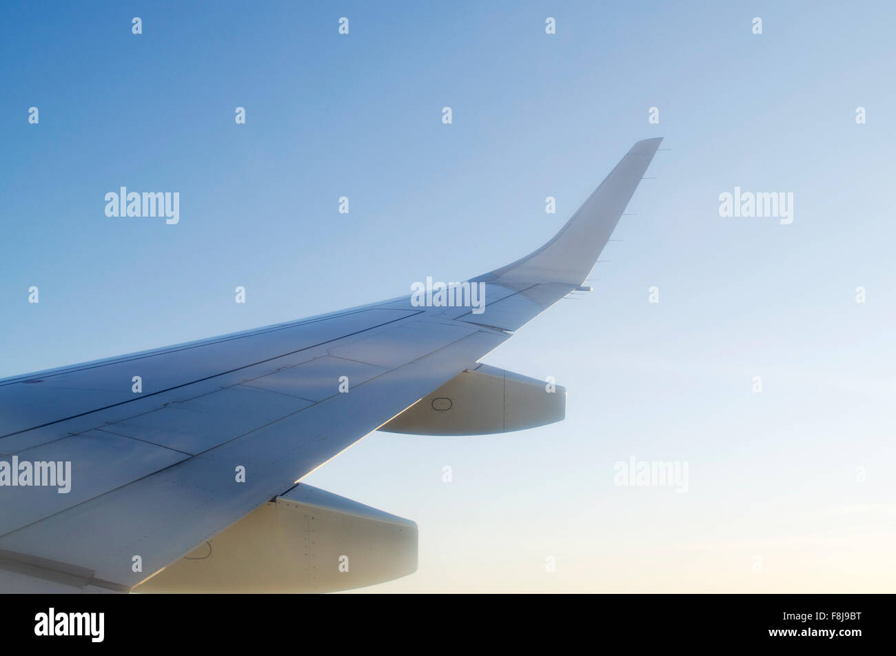Wing of airplane from window Stock Photo - Alamy