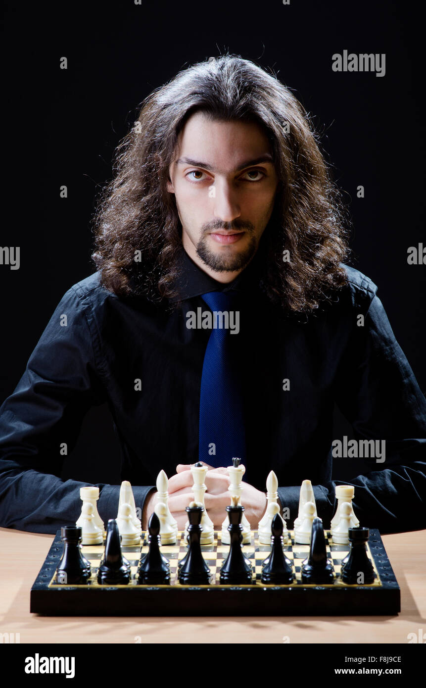 Chess player playing his game Stock Photo - Alamy