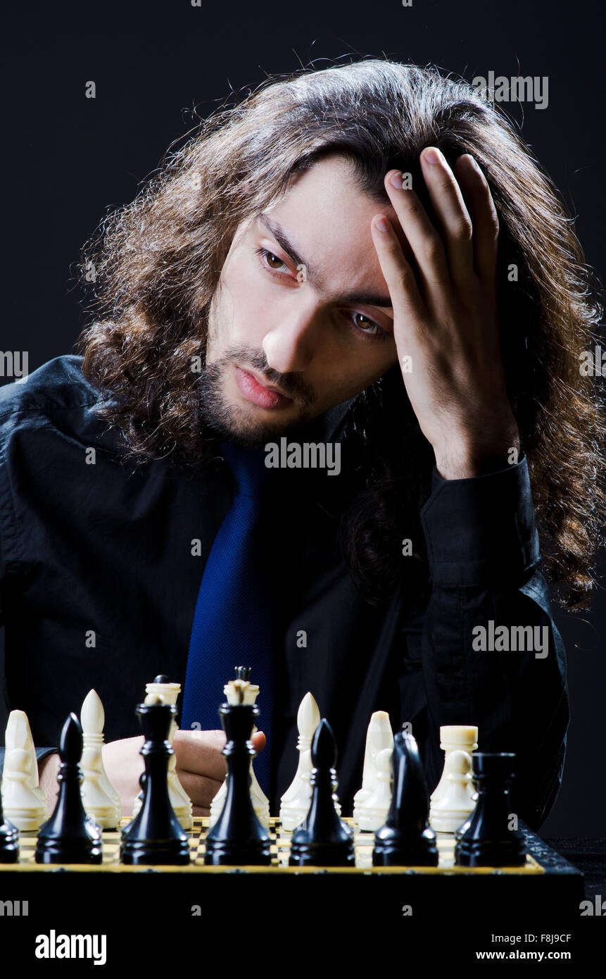 Chess player playing his game Stock Photo - Alamy