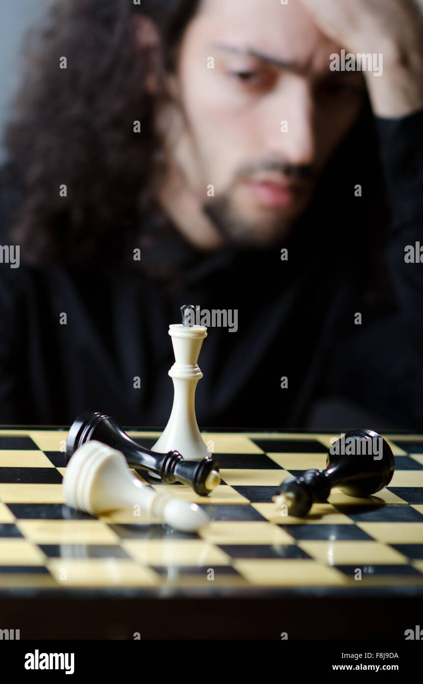 Chess player playing his game Stock Photo - Alamy
