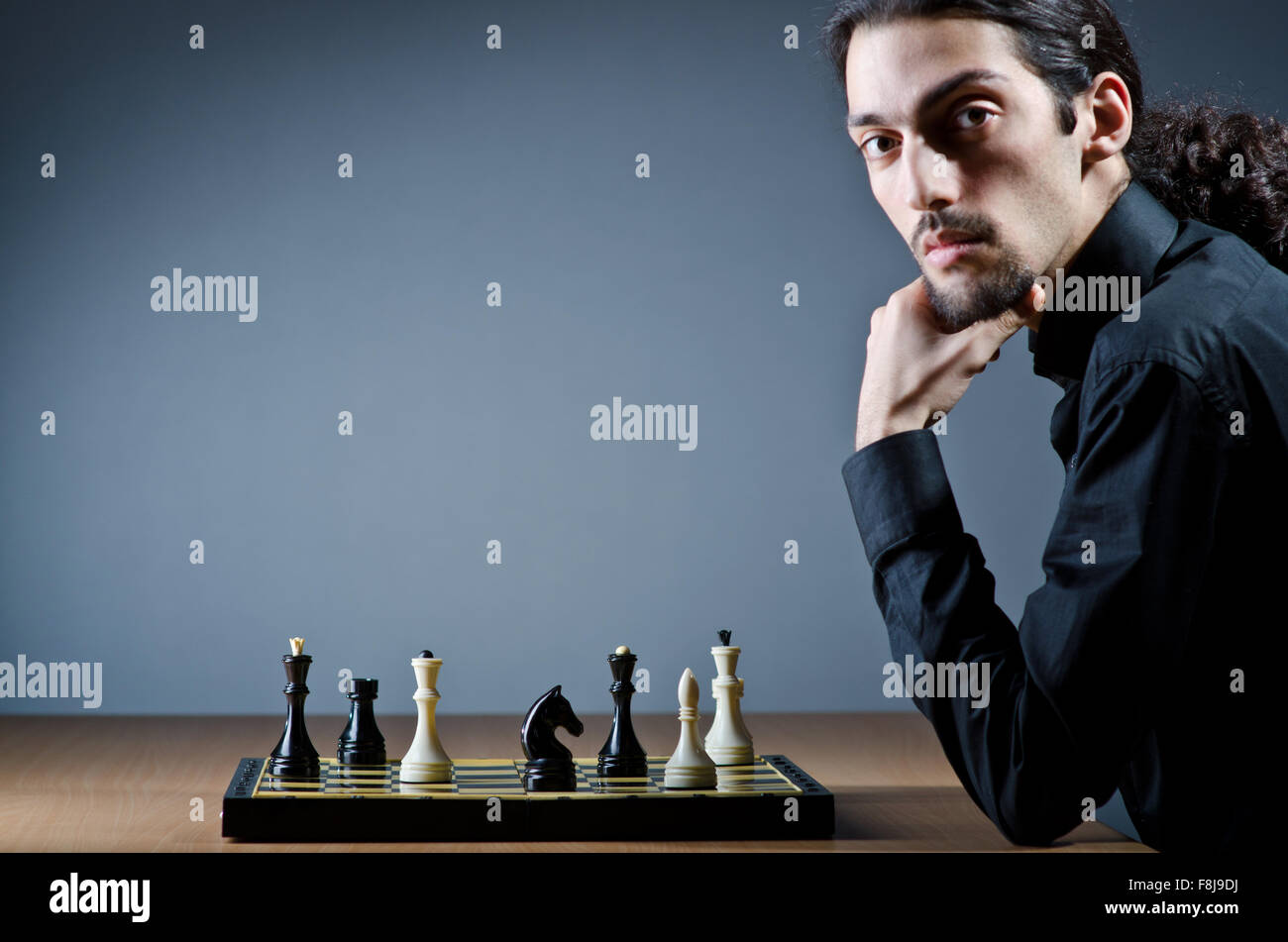 Chess player playing his game Stock Photo - Alamy