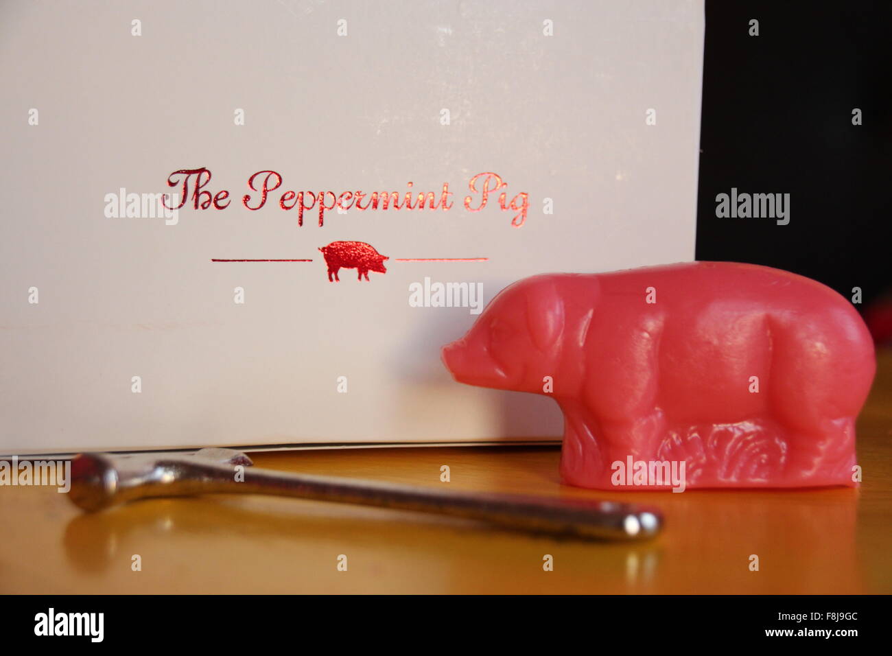 New York, USA. 5th Dec, 2015. A pink-coloured peppermint pig and a ...