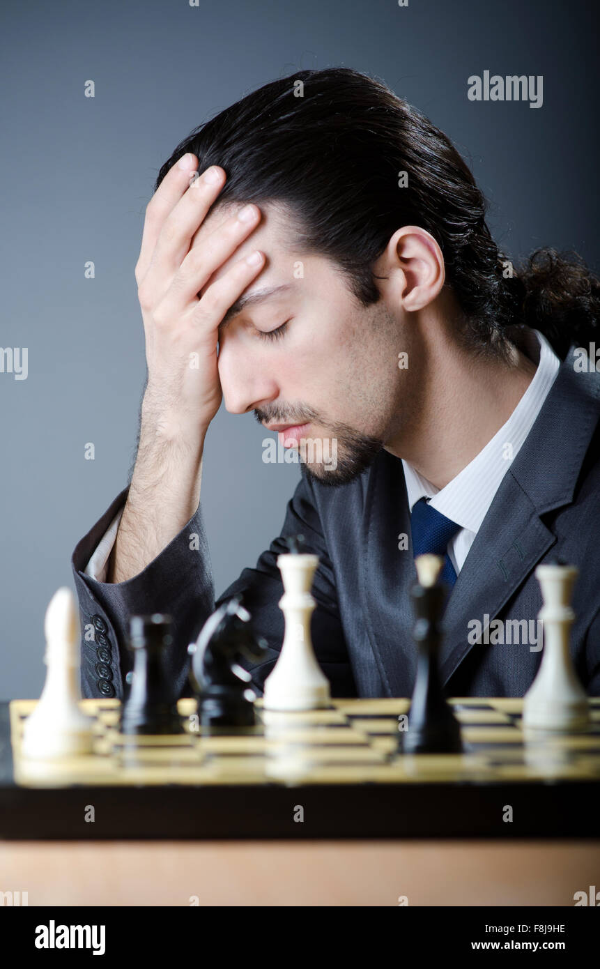 Chess player playing his game Stock Photo - Alamy