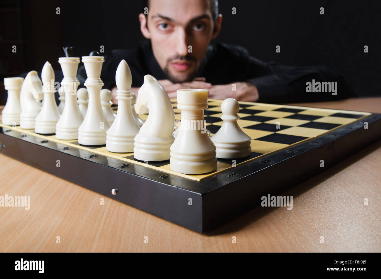 Chess player playing his game Stock Photo - Alamy