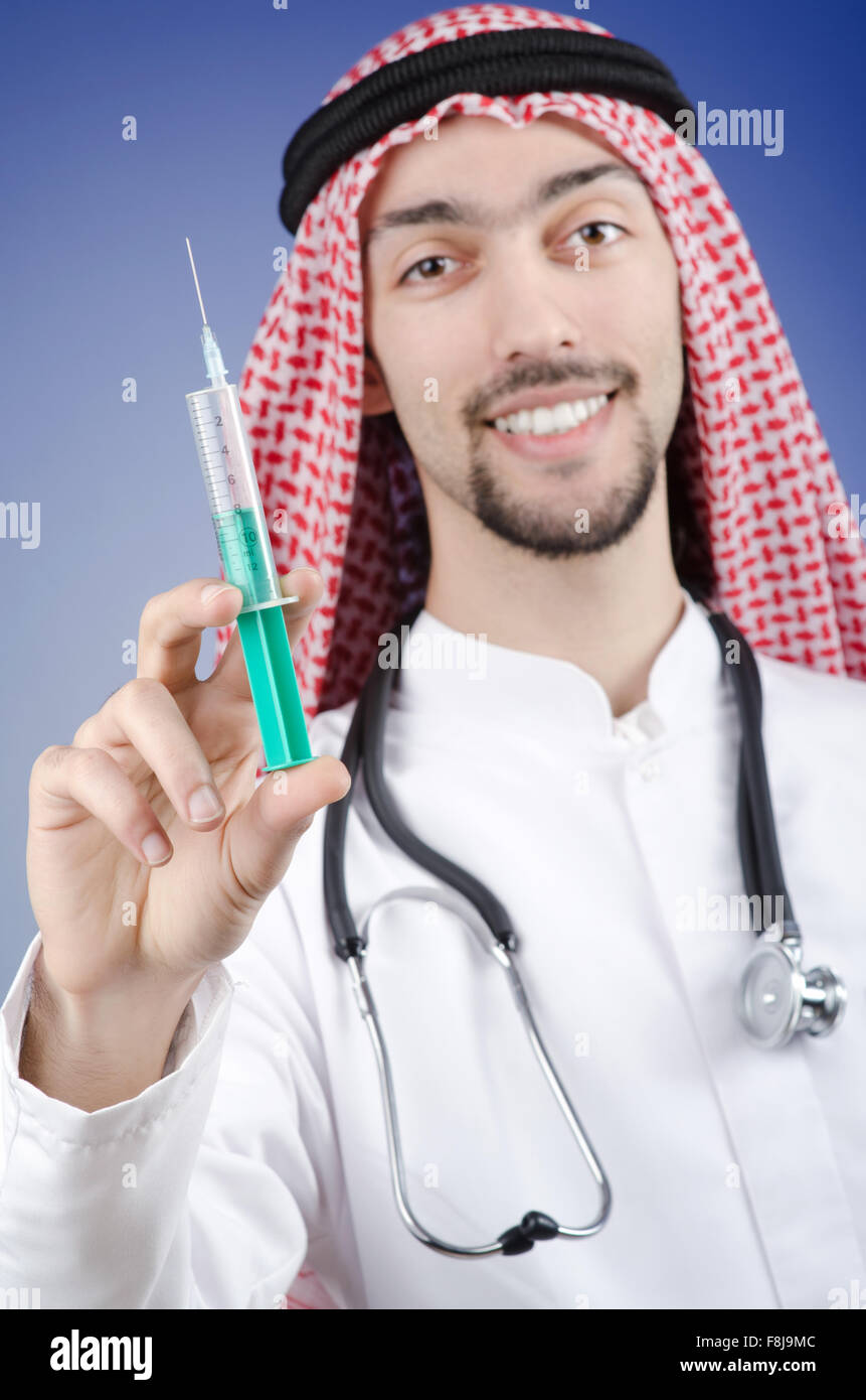 Arab doctor with syringe Stock Photo - Alamy
