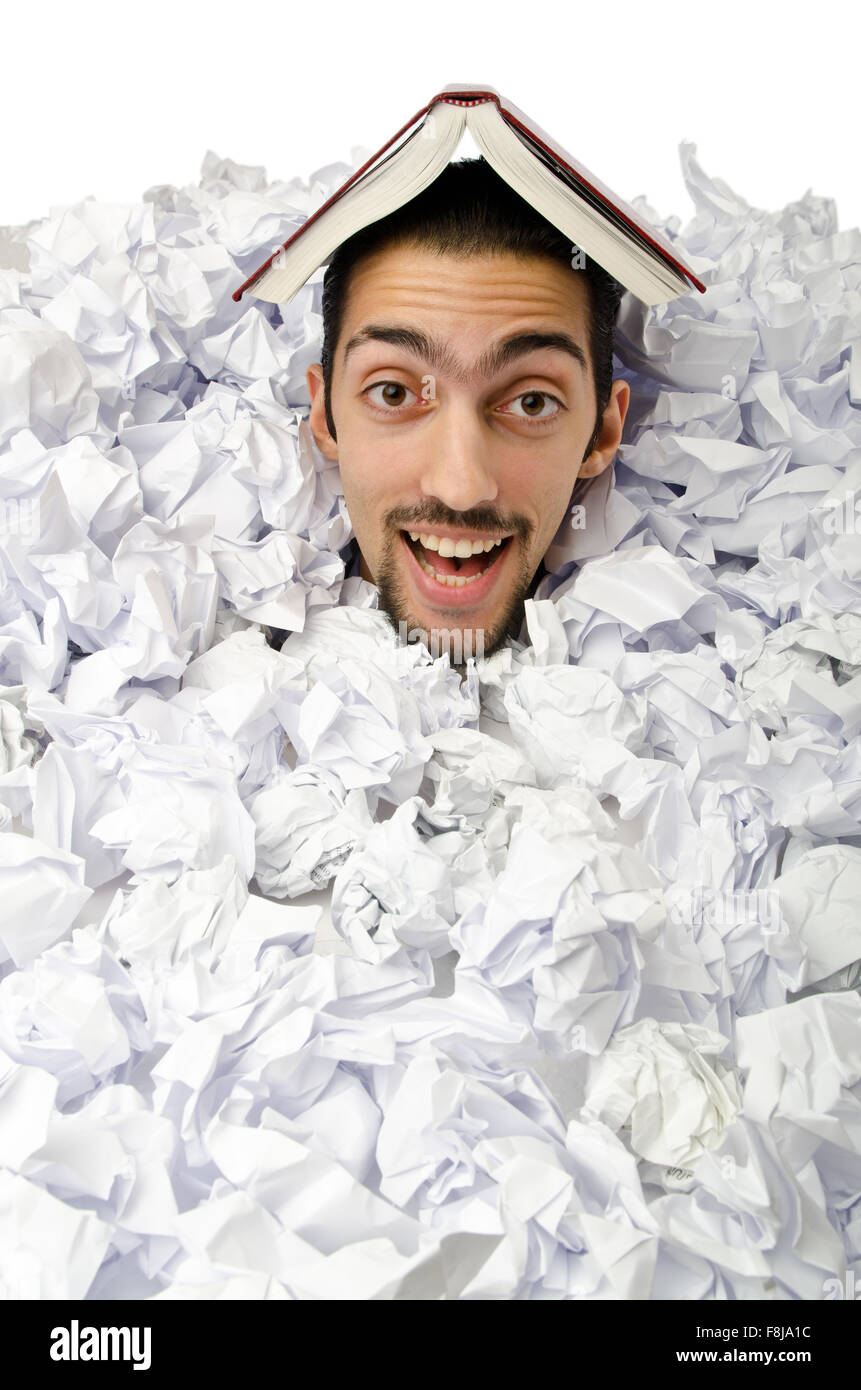 Man with lots of crumpled paper Stock Photo - Alamy