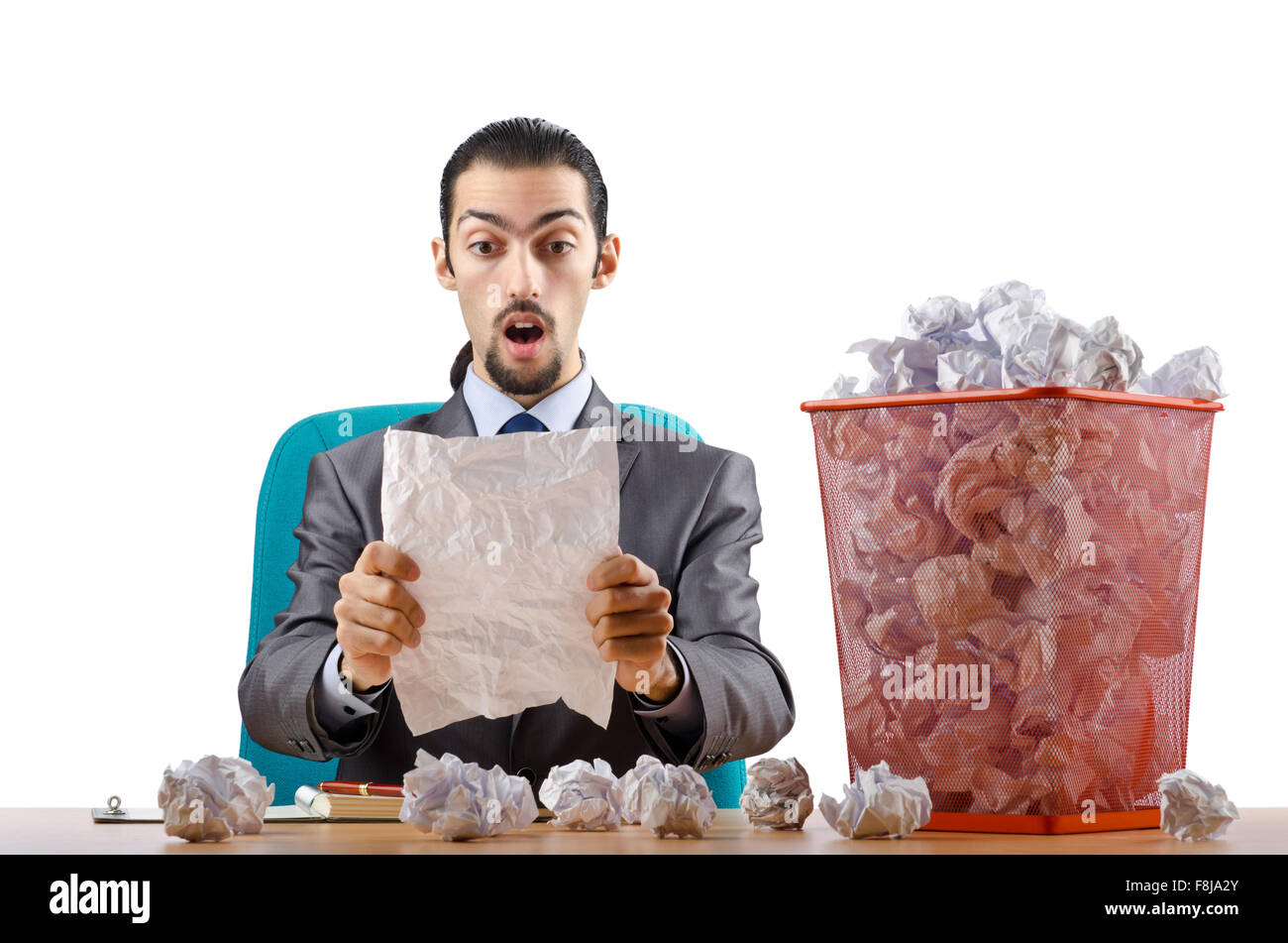 Man with lots of wasted paper Stock Photo - Alamy