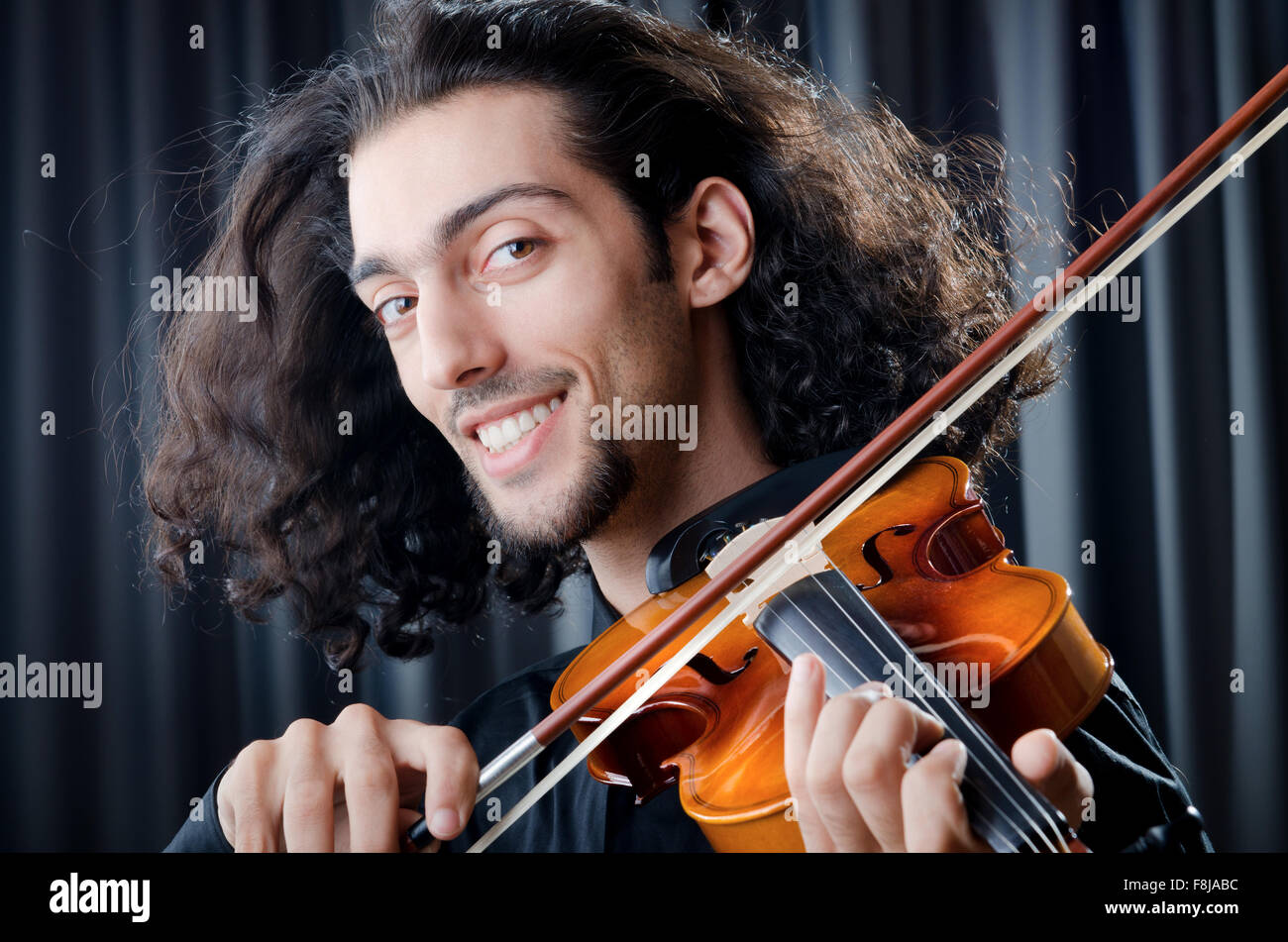Violin player playing the intstrument Stock Photo - Alamy