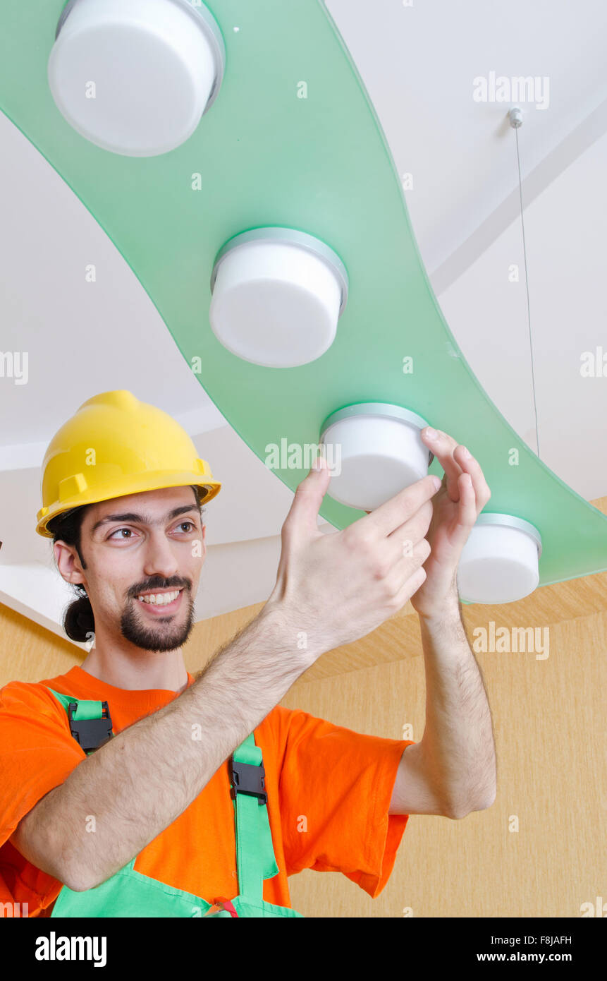 Electrician working on cabling lighting Stock Photo - Alamy