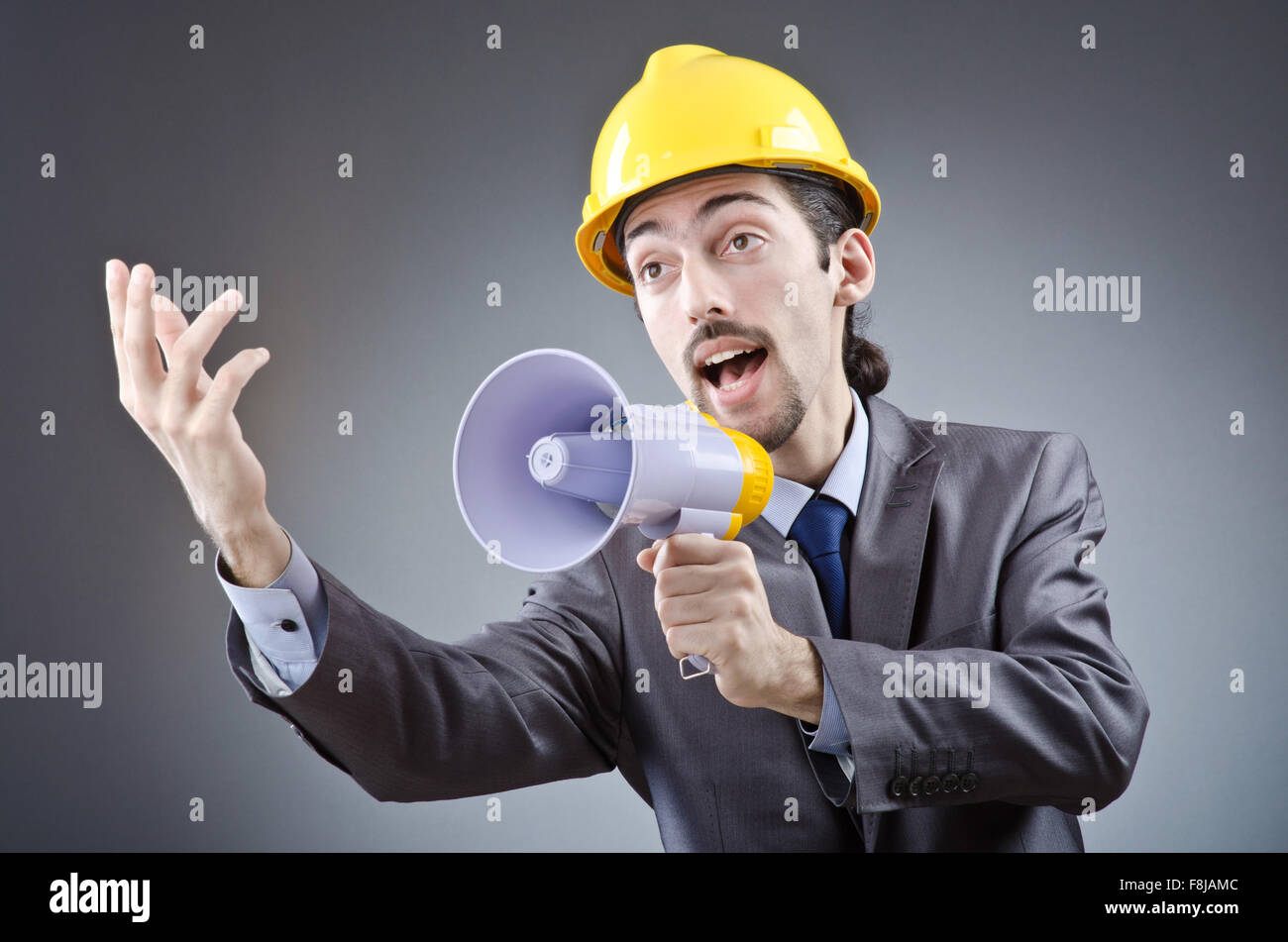 Man shouting and yelling with loudspeaker Stock Photo - Alamy