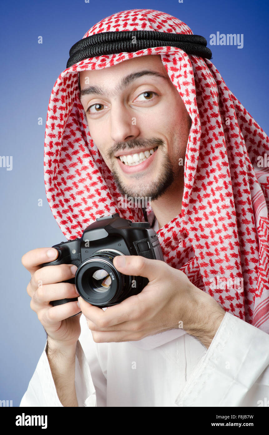 Arab photographer in studio shooting Stock Photo - Alamy