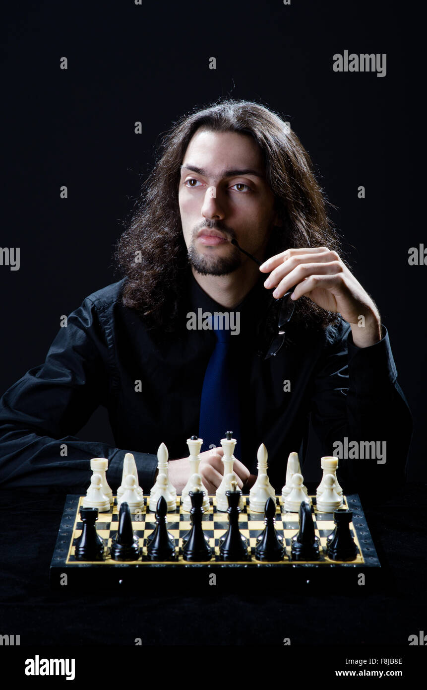 Chess player playing his game Stock Photo - Alamy