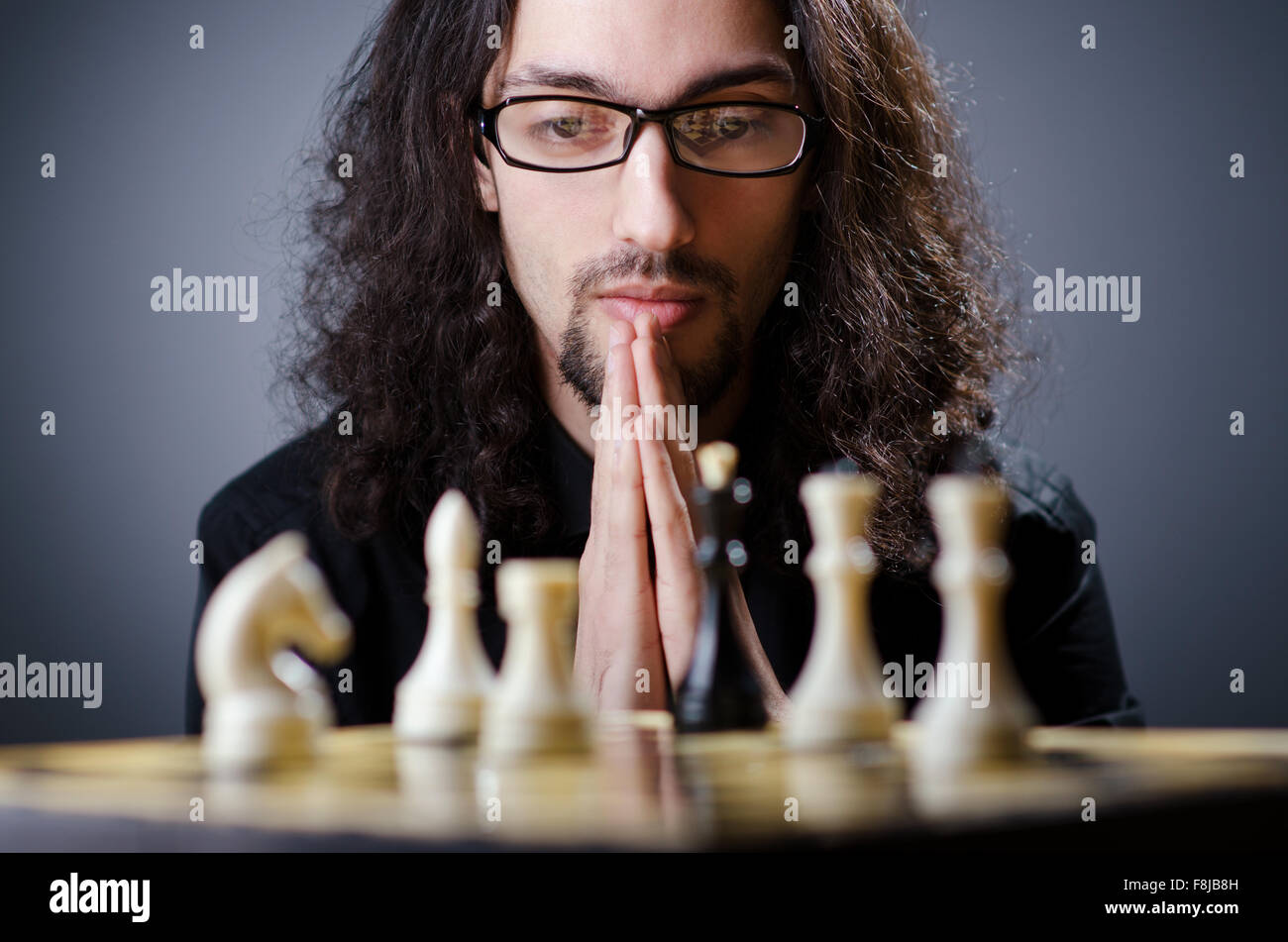 Chess player playing his game Stock Photo - Alamy