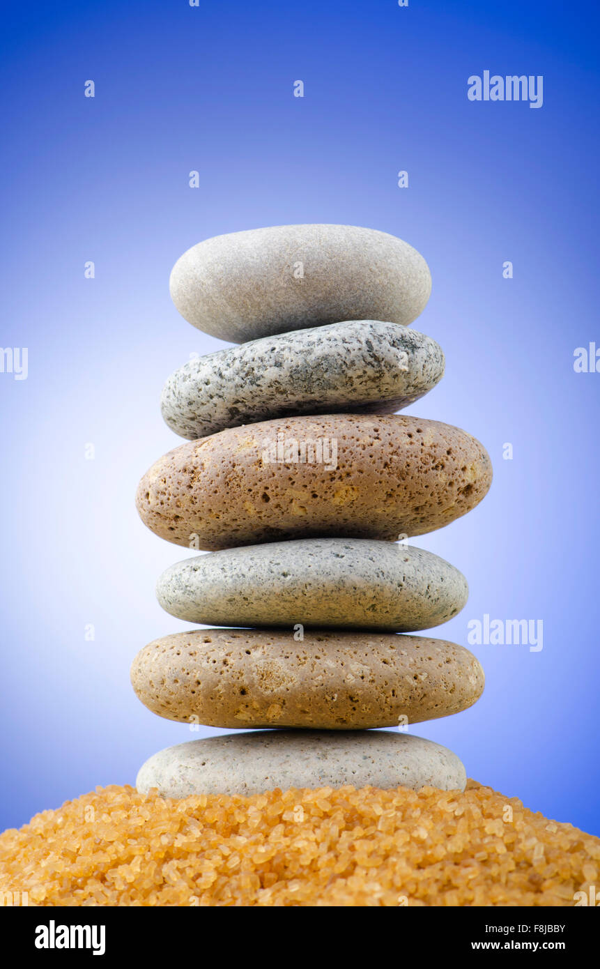 Balanced pebbles with colour background Stock Photo - Alamy