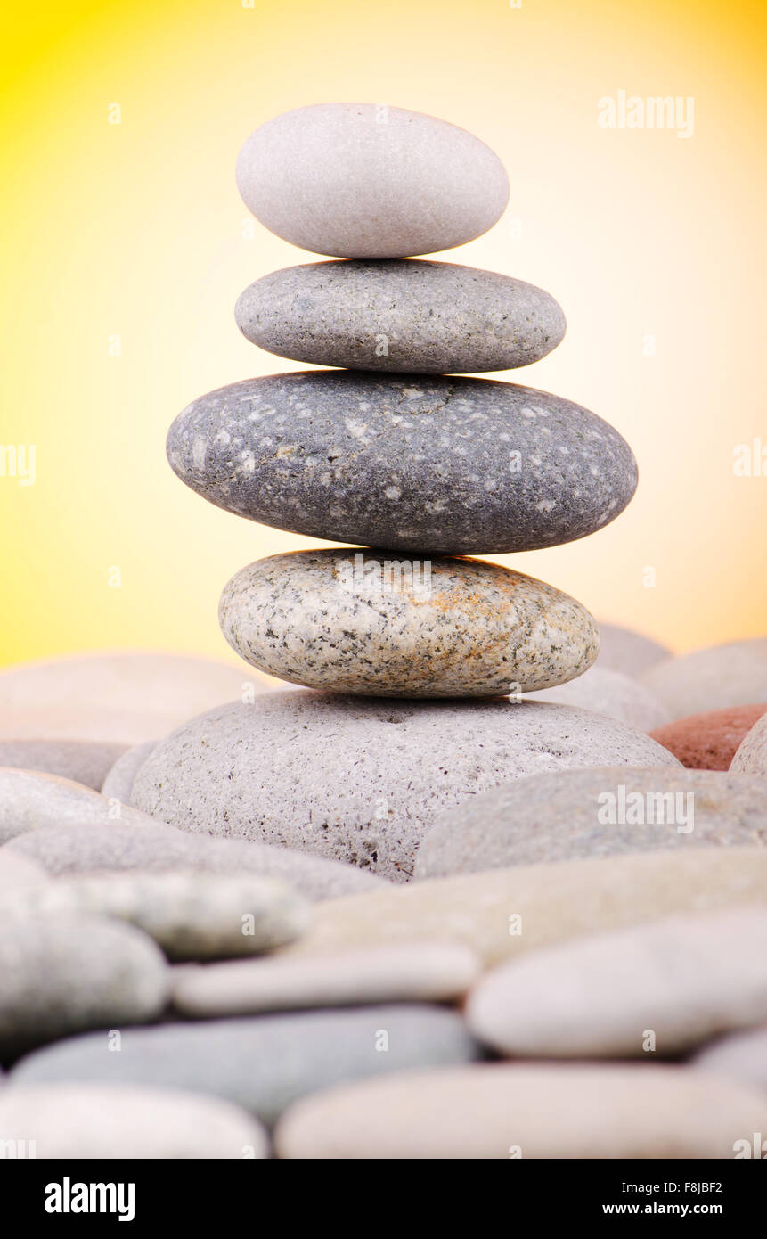 Pebbles stack against gradient background Stock Photo - Alamy