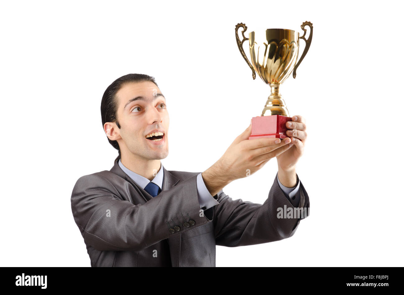 Man being awarded with golden cup Stock Photo - Alamy