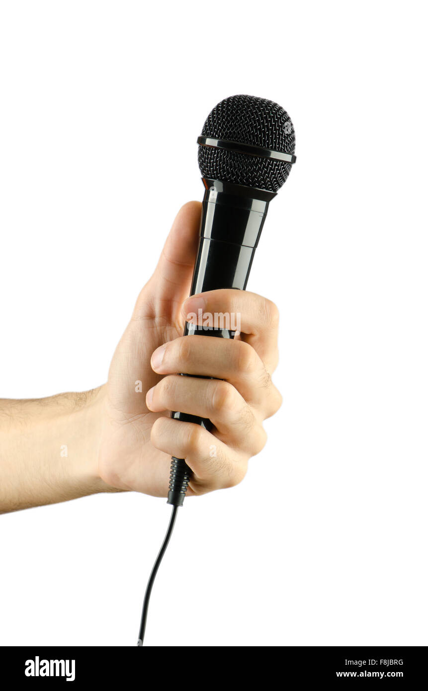 Hand holding microphone on white Stock Photo - Alamy