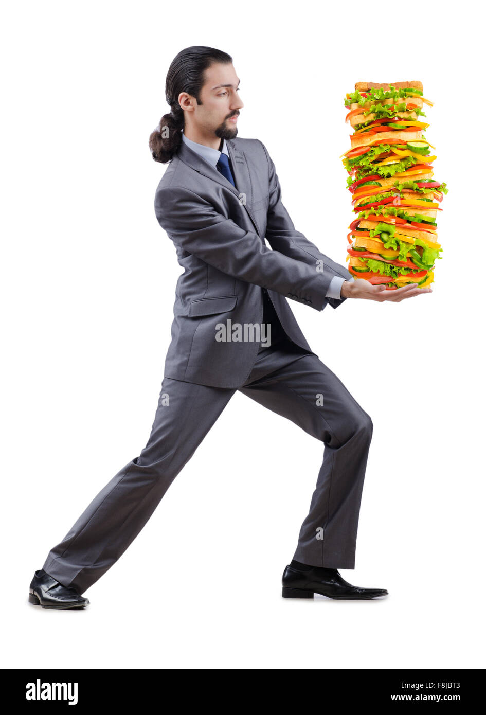 Man and giant sandwich on white Stock Photo - Alamy