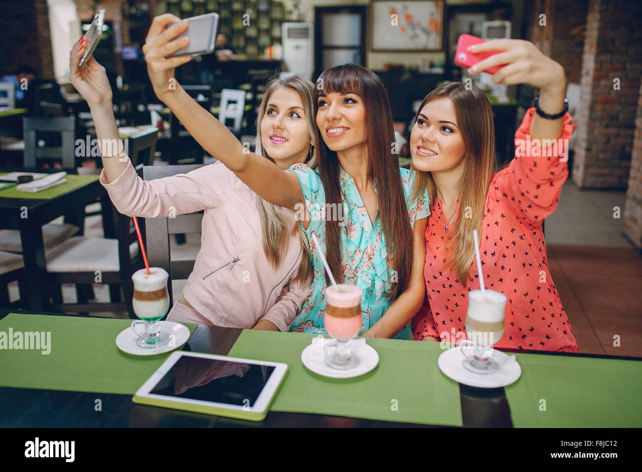 Girls with phones Stock Photo - Alamy