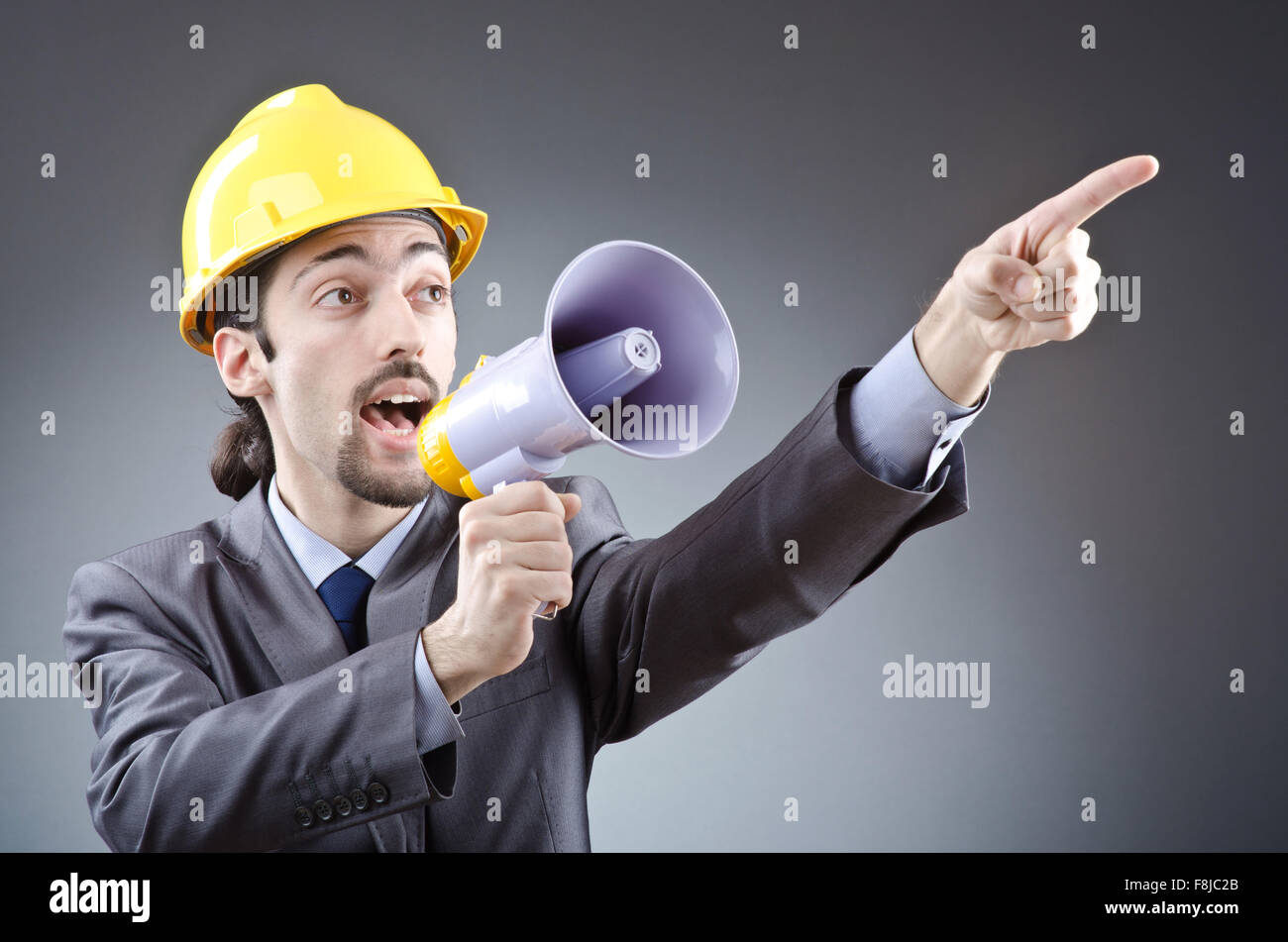 Man shouting and yelling with loudspeaker Stock Photo - Alamy