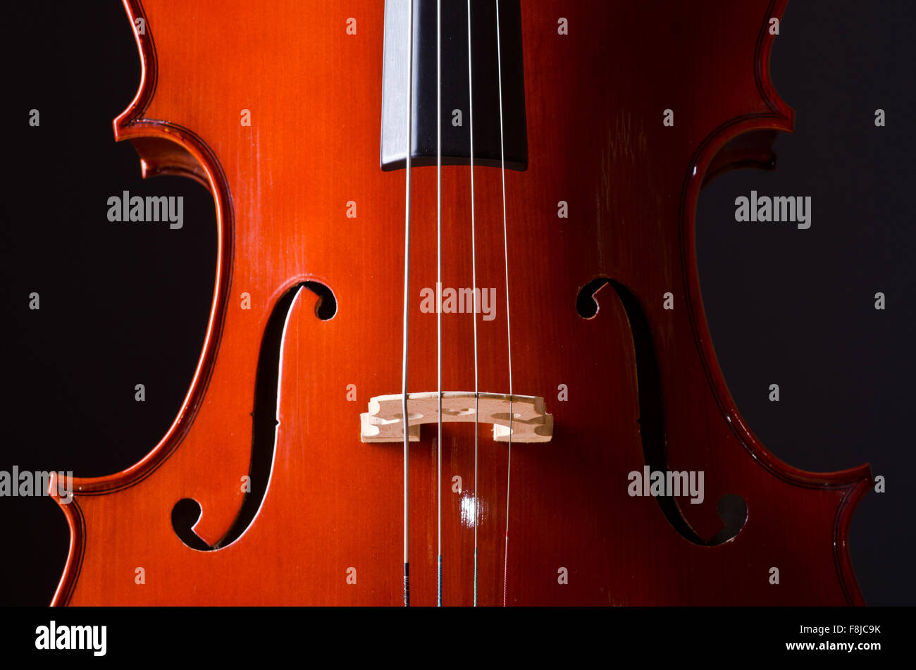 Music Cello in the dark room Stock Photo - Alamy