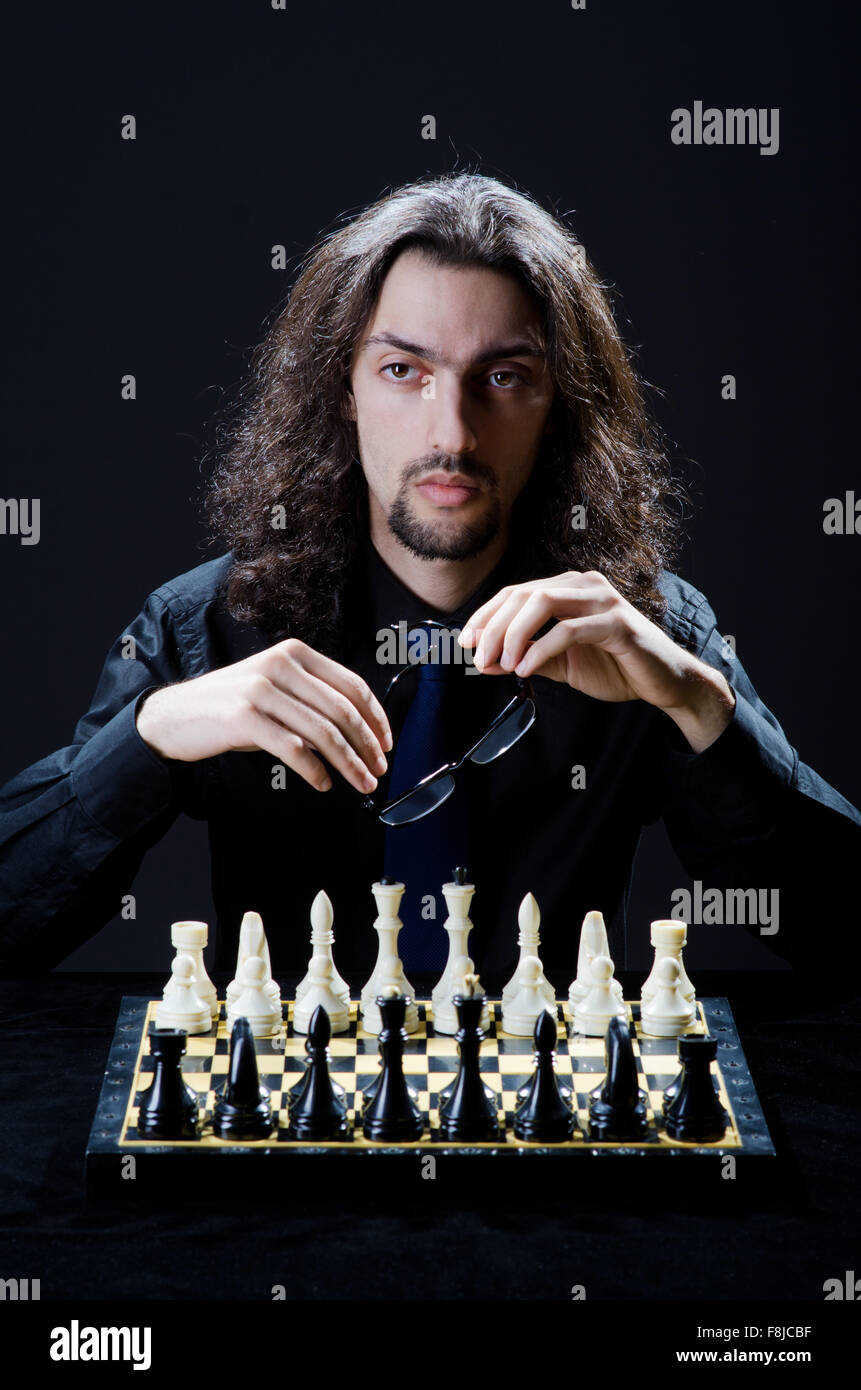 Chess player playing his game Stock Photo - Alamy