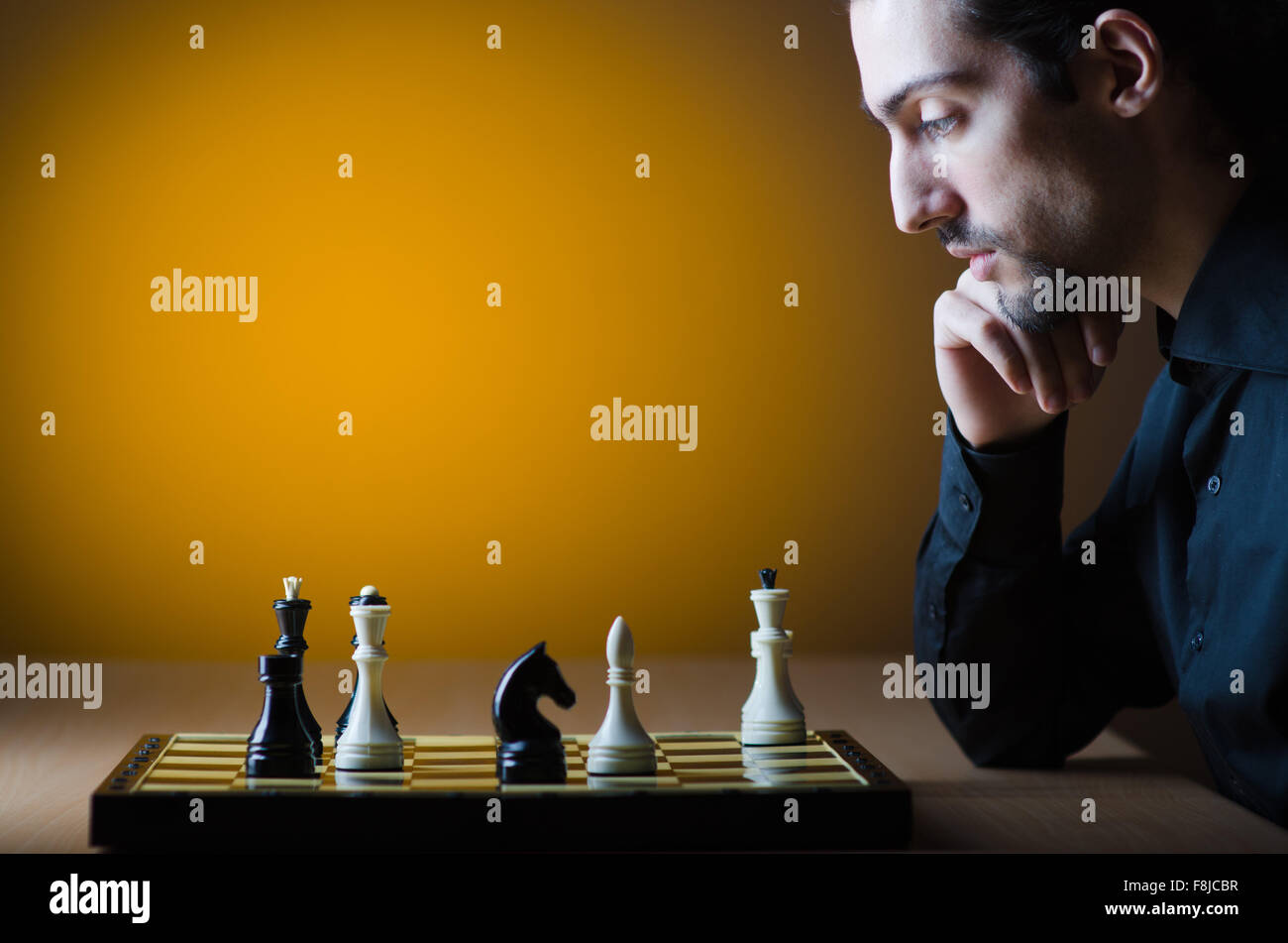Chess player playing his game Stock Photo - Alamy