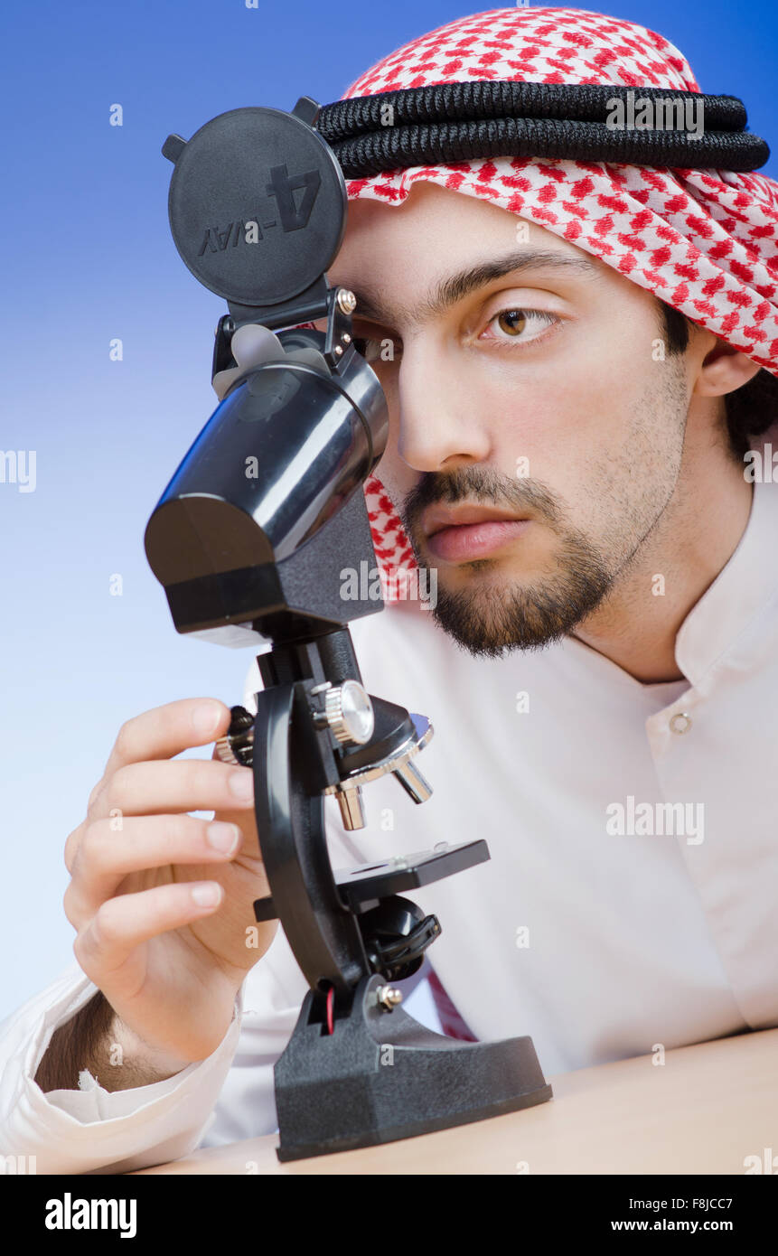 Arab chemist working in lab Stock Photo - Alamy
