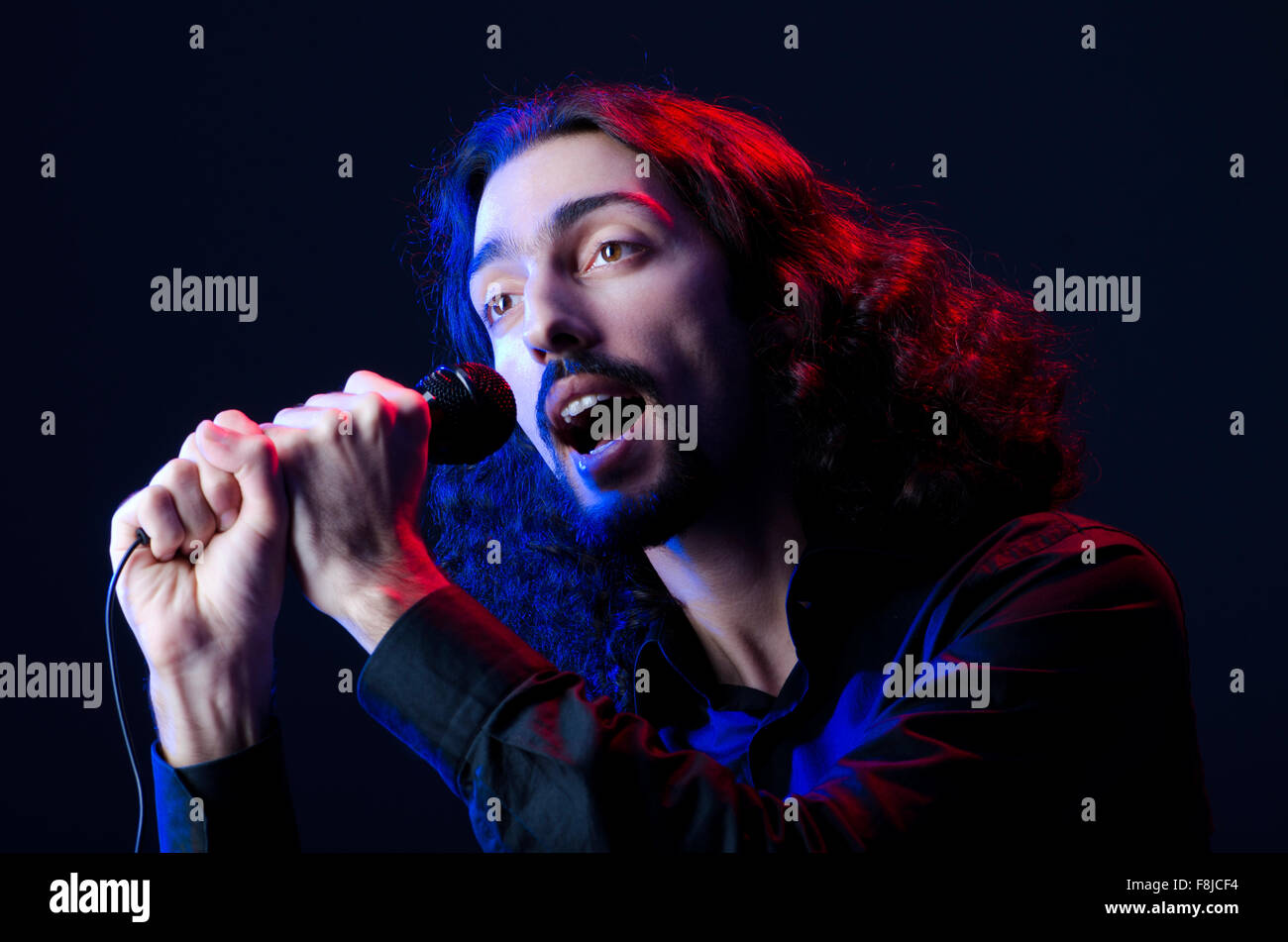 Man singing at the concert Stock Photo - Alamy