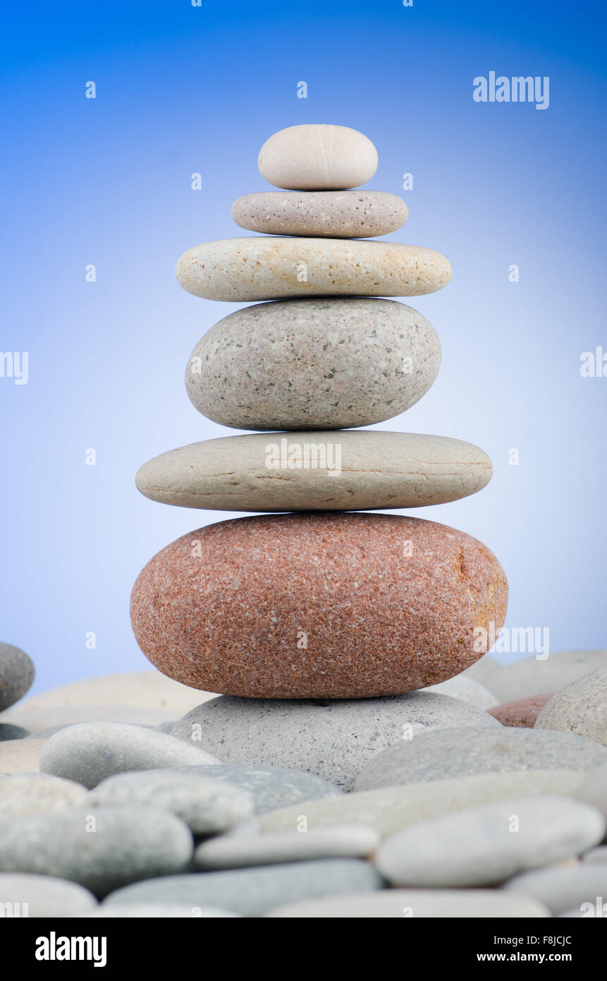 Pebbles stack against gradient background Stock Photo - Alamy