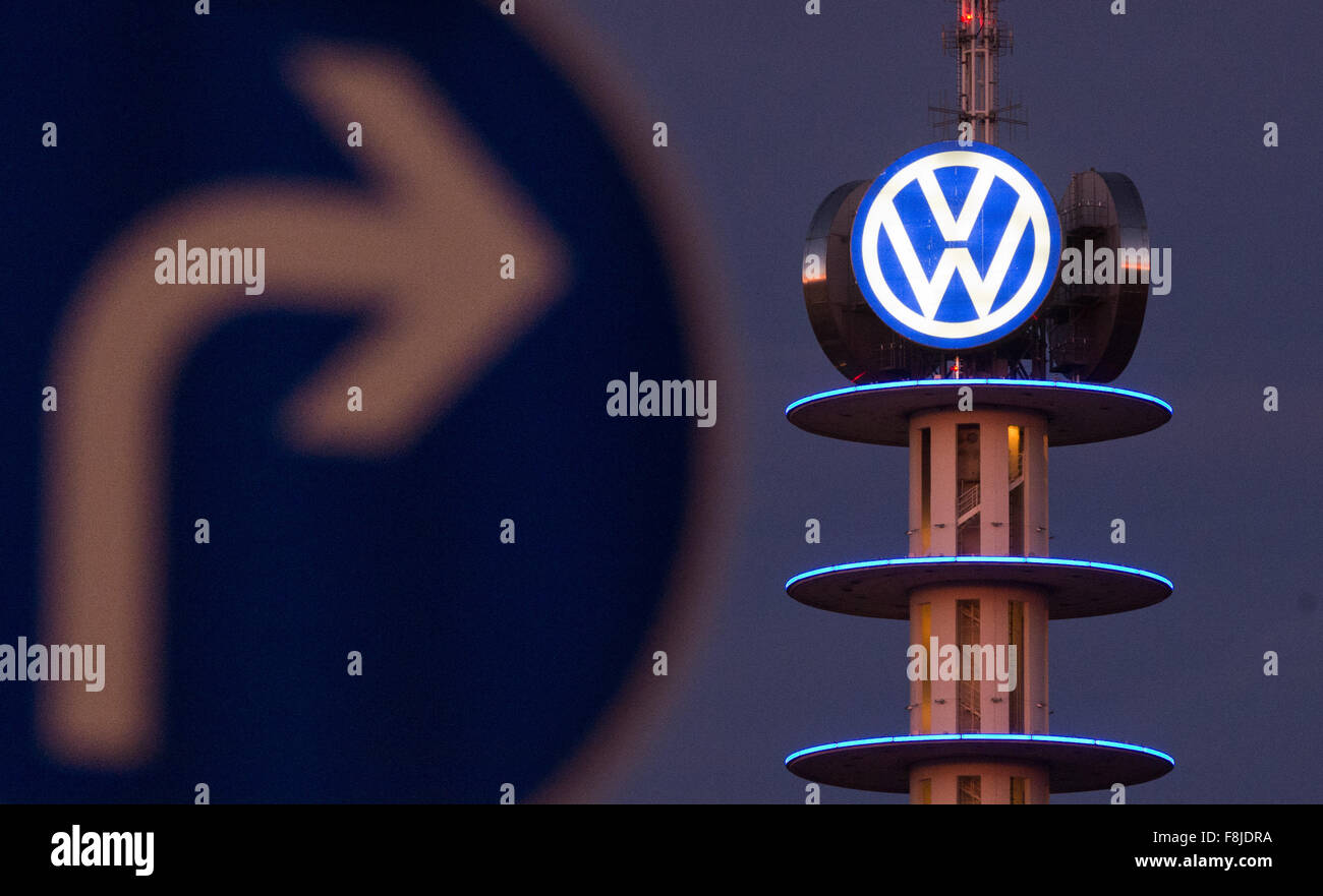 The illuminated logo of German car manufacturer Volkswagen at sunrise ...