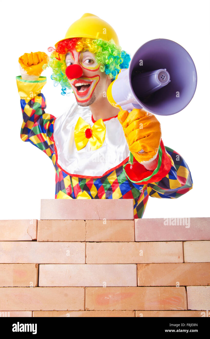 Bad construction concept with clown laying bricks Stock Photo - Alamy