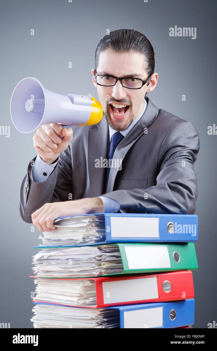Businessman shouting via loudspeaker Stock Photo - Alamy
