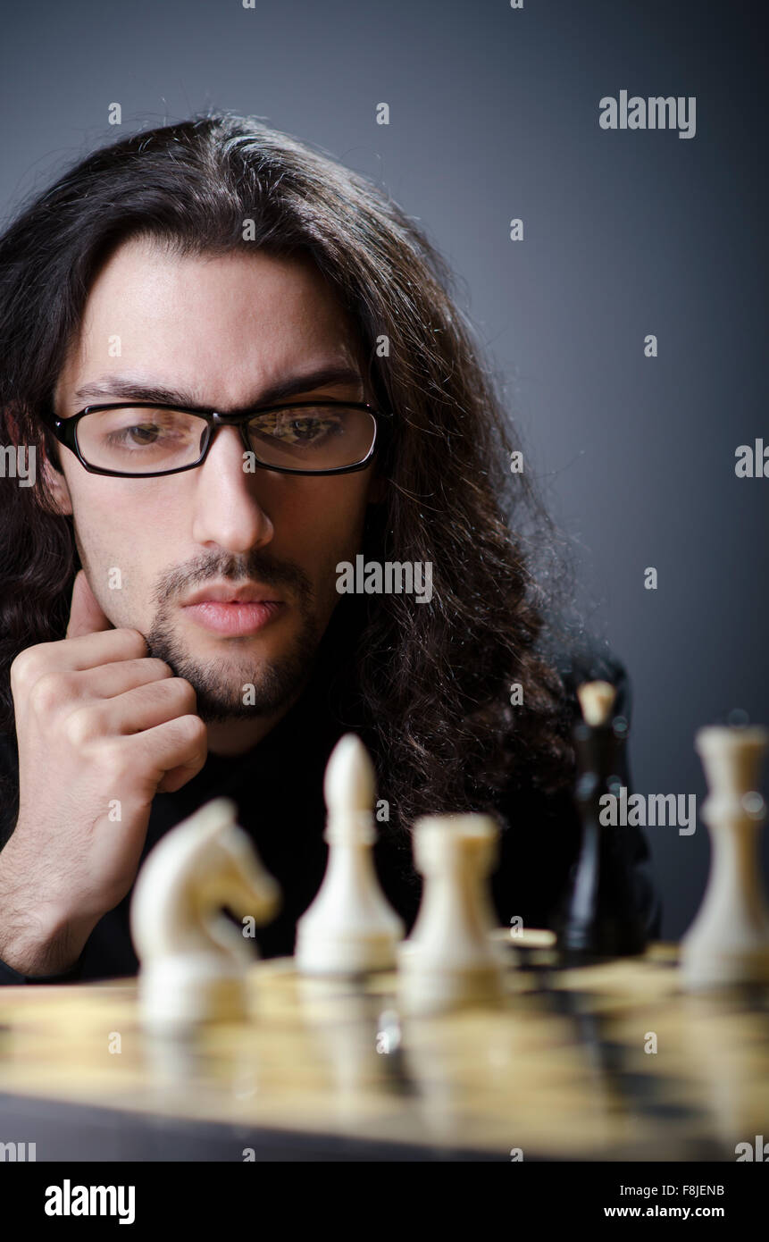 Chess player playing his game Stock Photo - Alamy