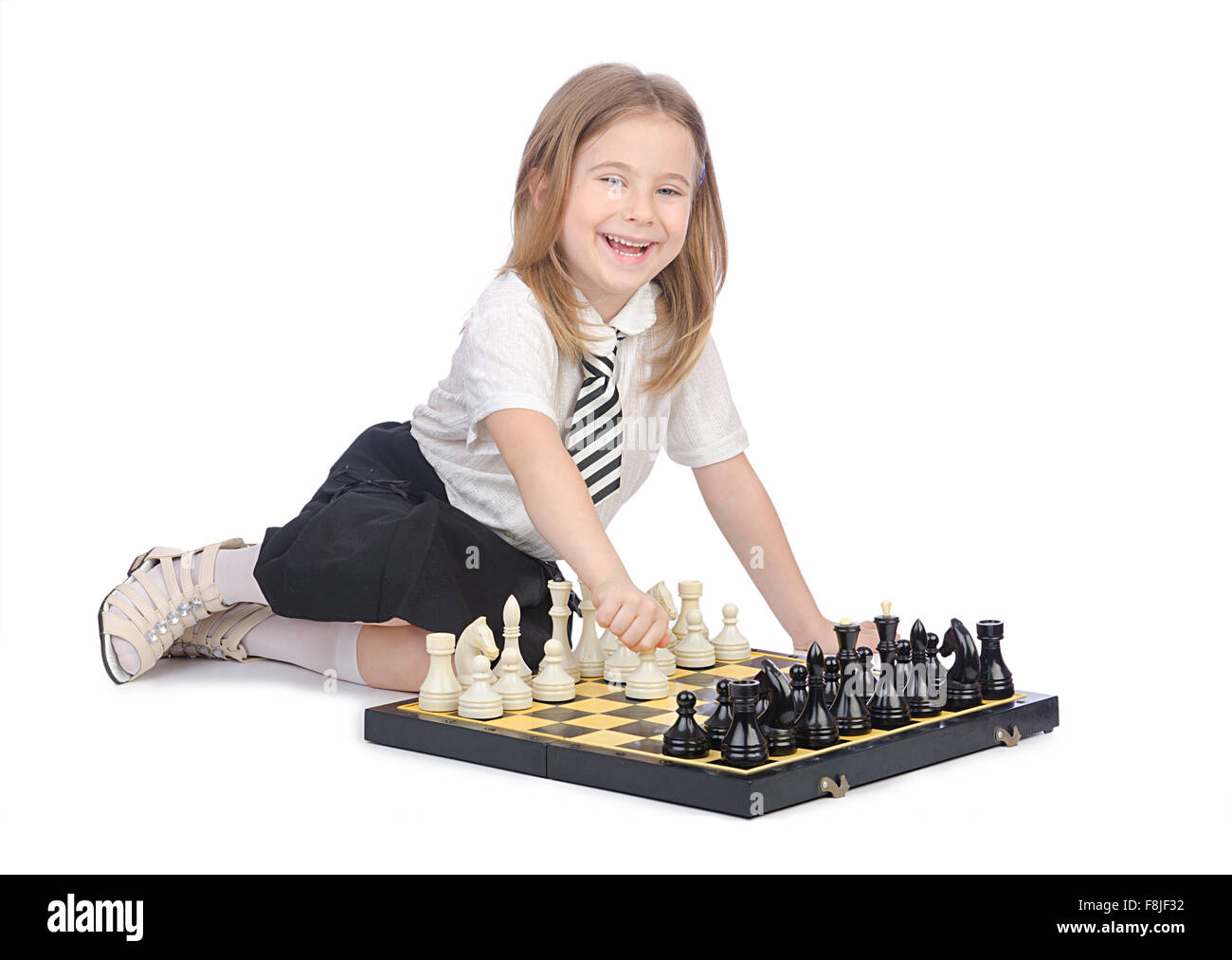 Cute girl playing chess on white Stock Photo - Alamy