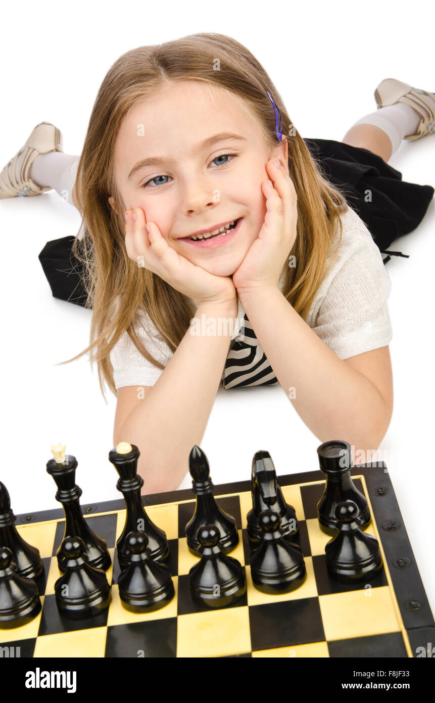 Cute girl playing chess on white Stock Photo - Alamy