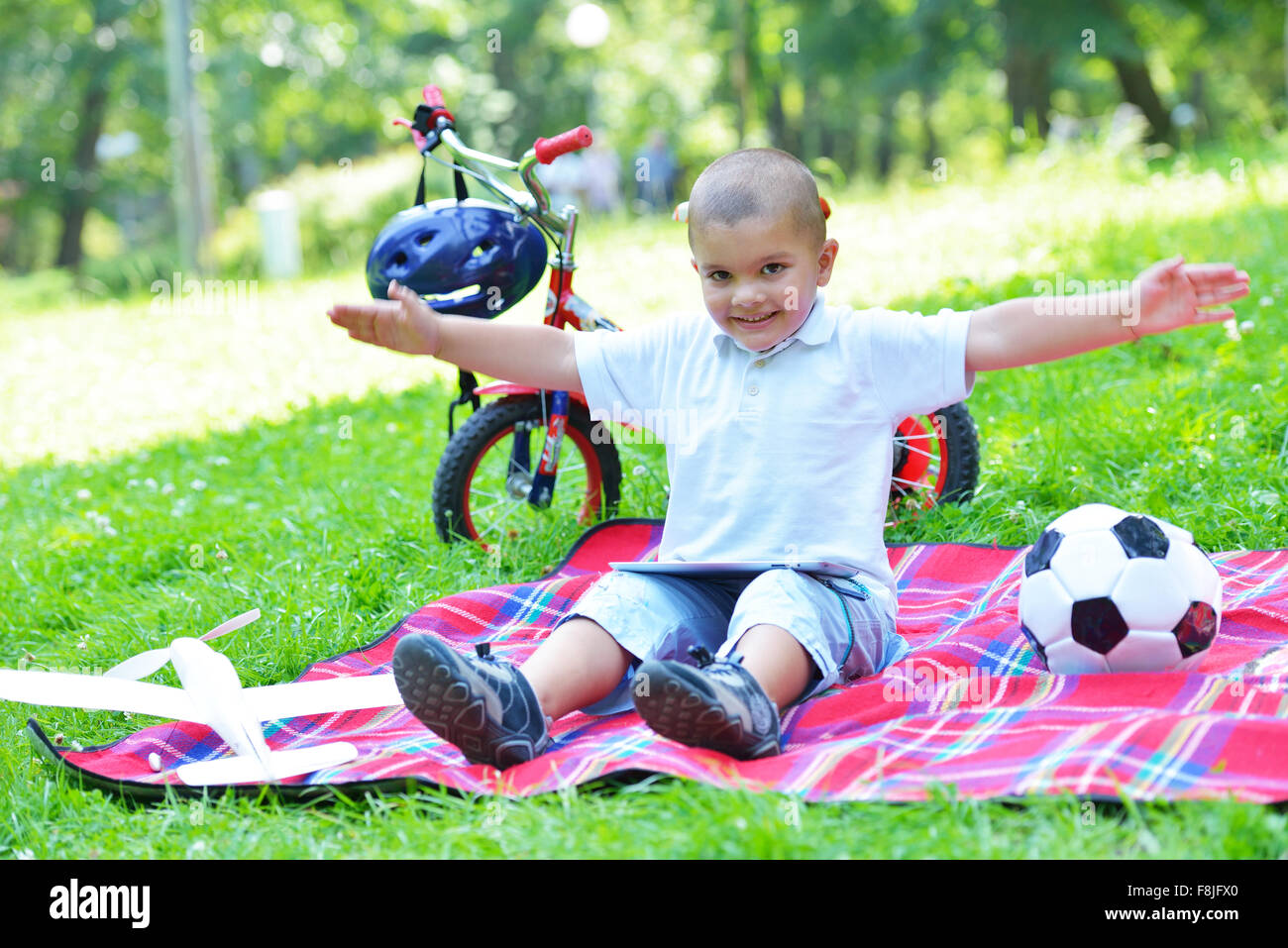 happy boy play and throw airplane in park Stock Photo - Alamy