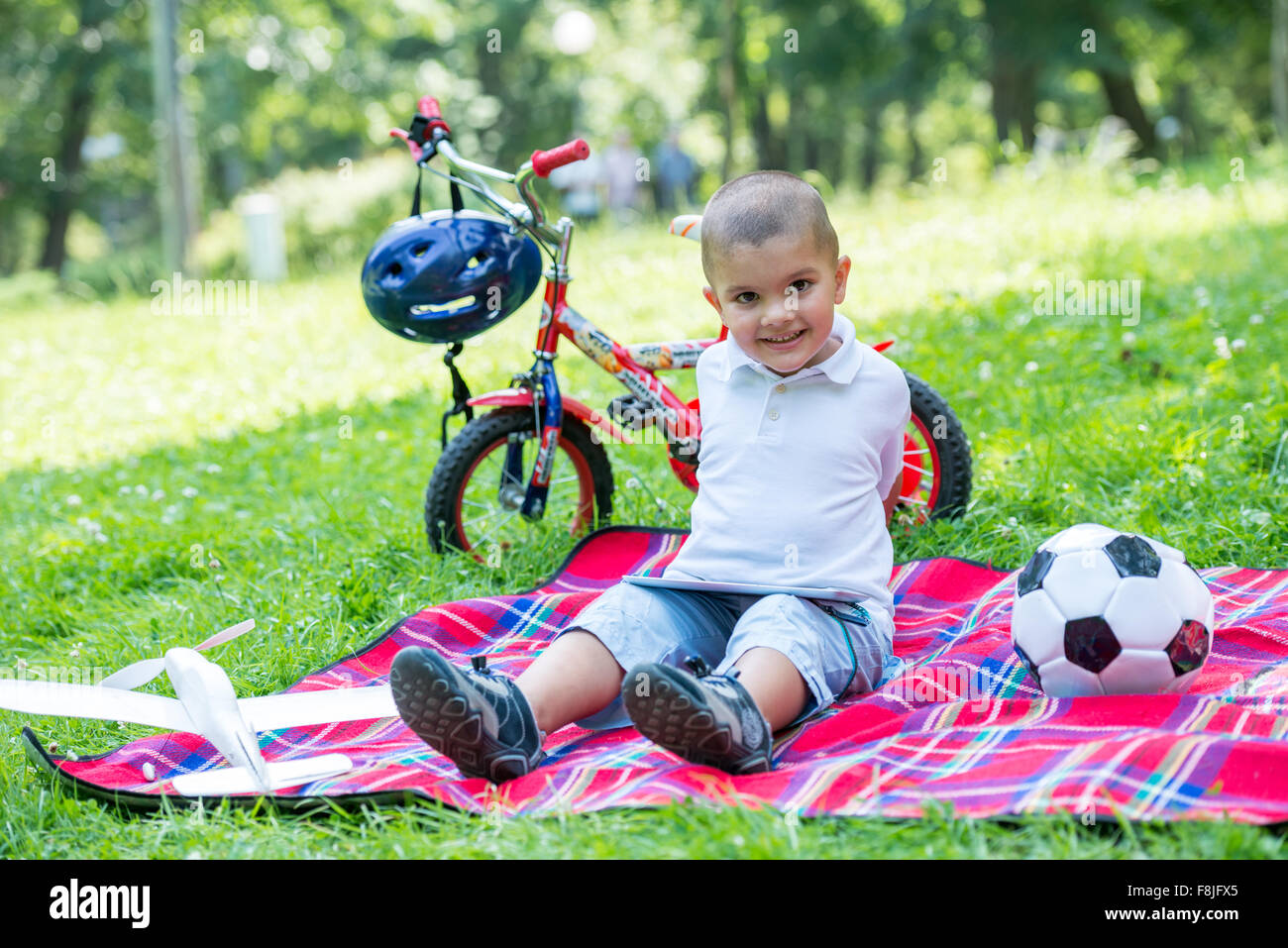 happy boy play and throw airplane toy in park Stock Photo - Alamy