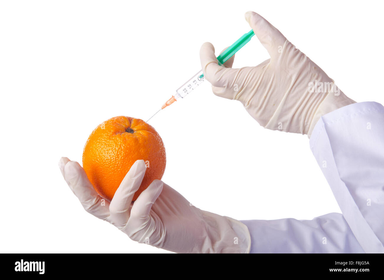 Science experiment with orange and syringe Stock Photo - Alamy